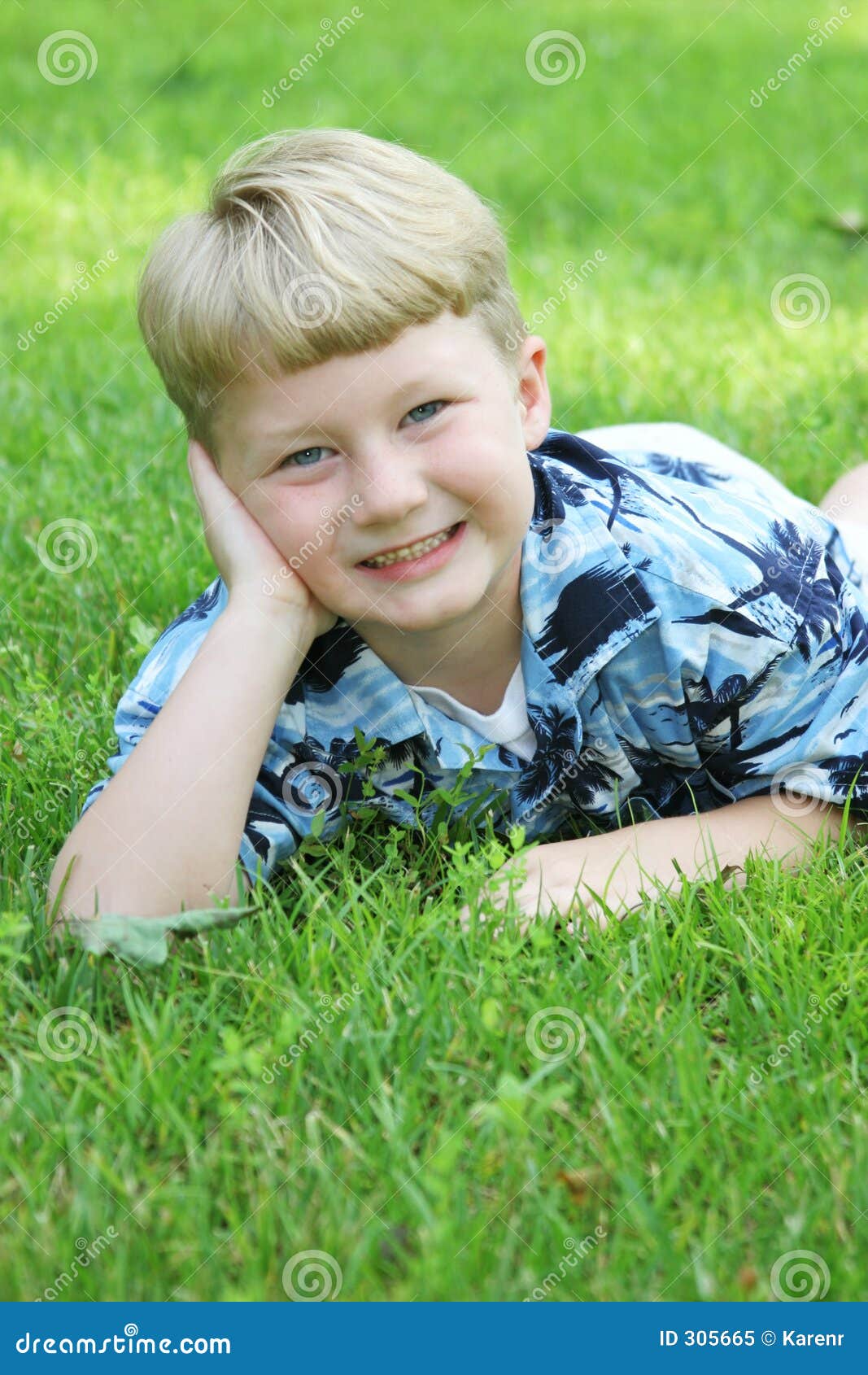 Boy lying on grass stock image. Image of grass, happy, people - 305665