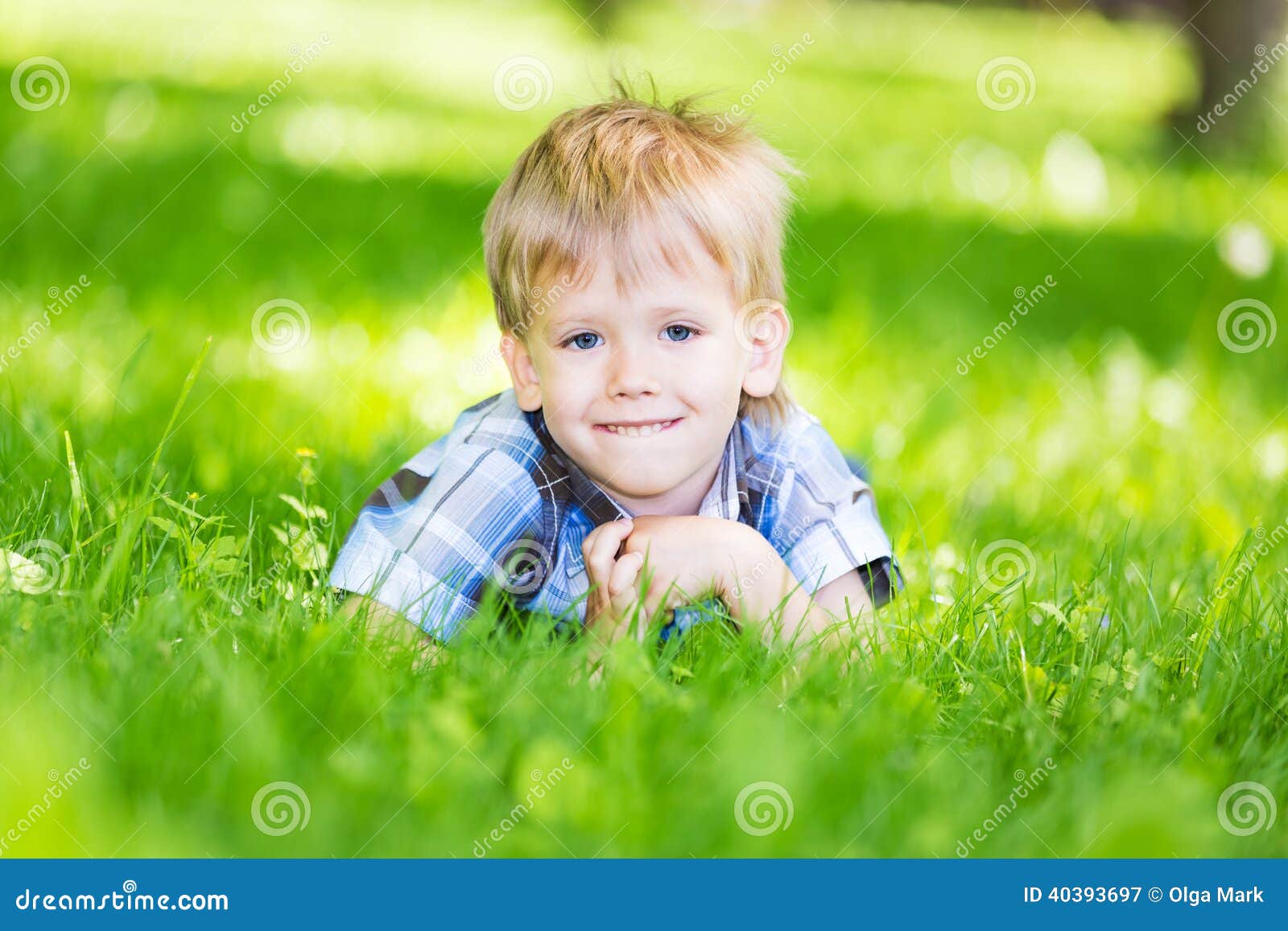 Boy lying in grass stock image. Image of blond, adolescent - 40393697