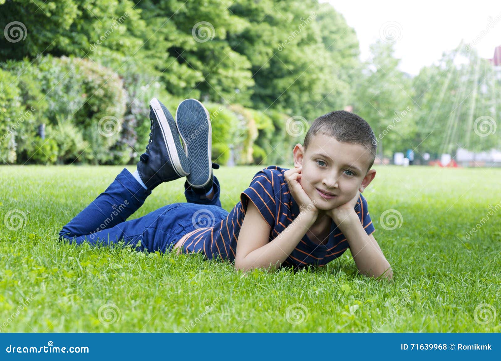 Boy Lying On The Grass In The Park Stock Photo - Image of childhood ...