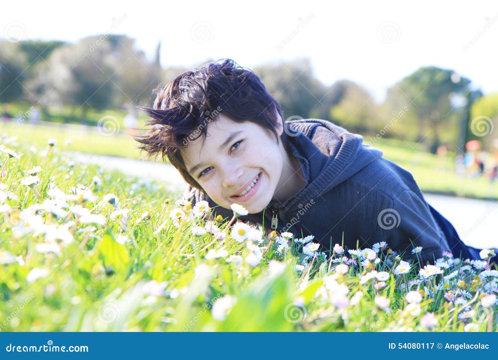 Boy lying on green grass stock image. Image of children - 54080117
