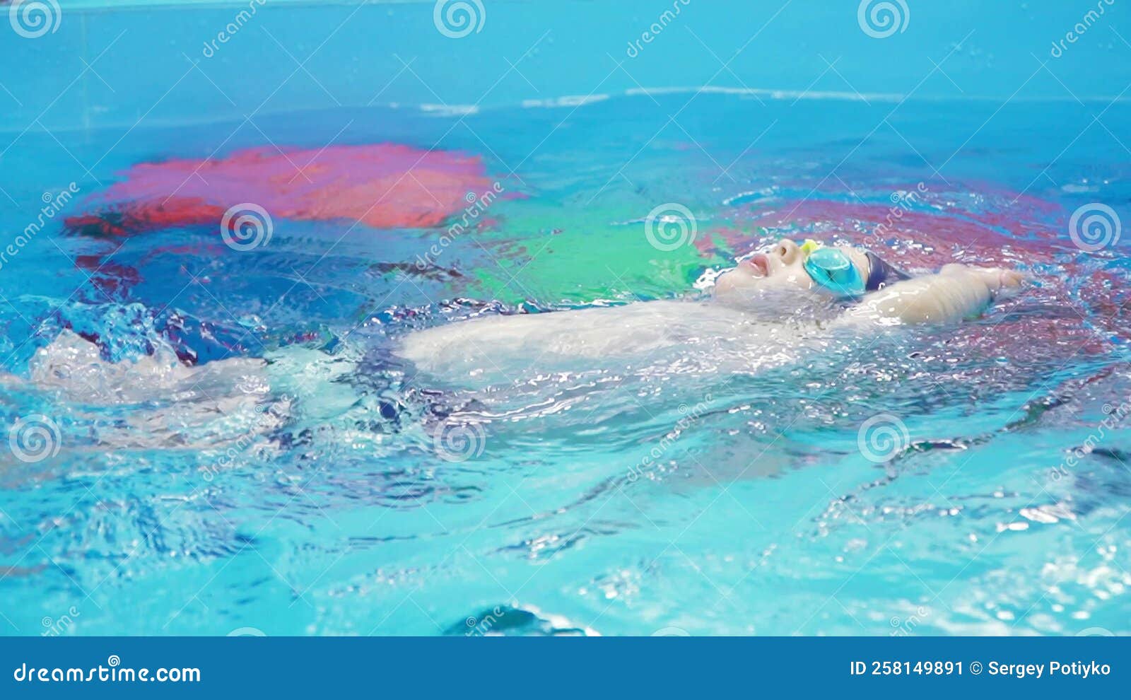 Boy lying on the pool stock video. Video of aquatherapy - 258149891