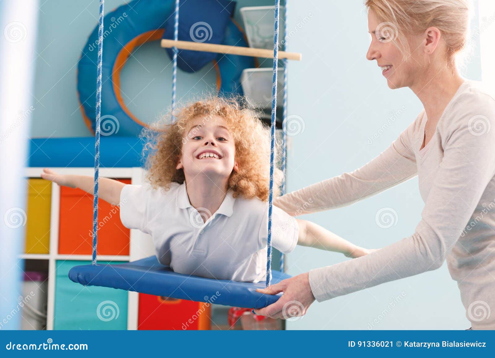 Boy lying on swing stock image. Image of body, sensory - 91336021