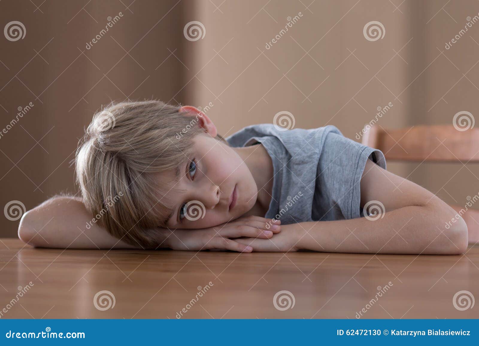 Boy lying on the table stock photo. Image of depression - 62472130