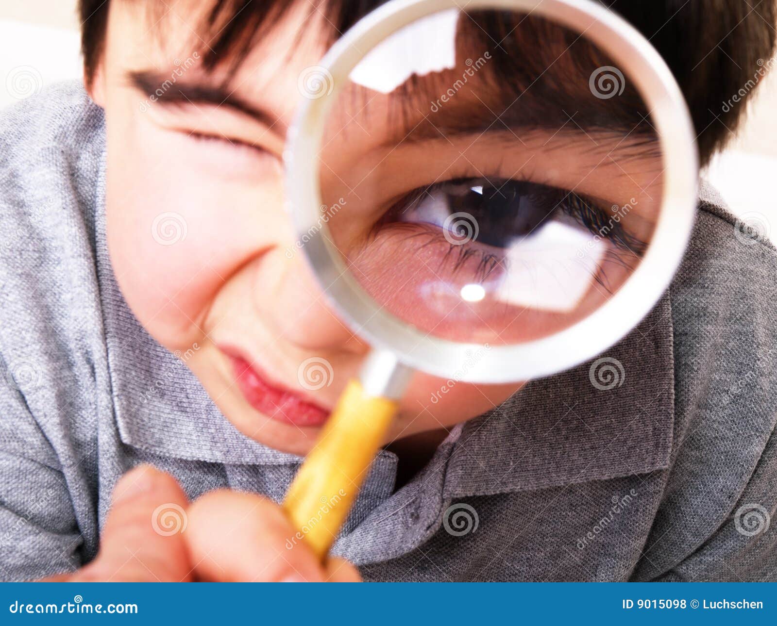 Boy and magnify glass stock photo. Image of looking, people - 9015098