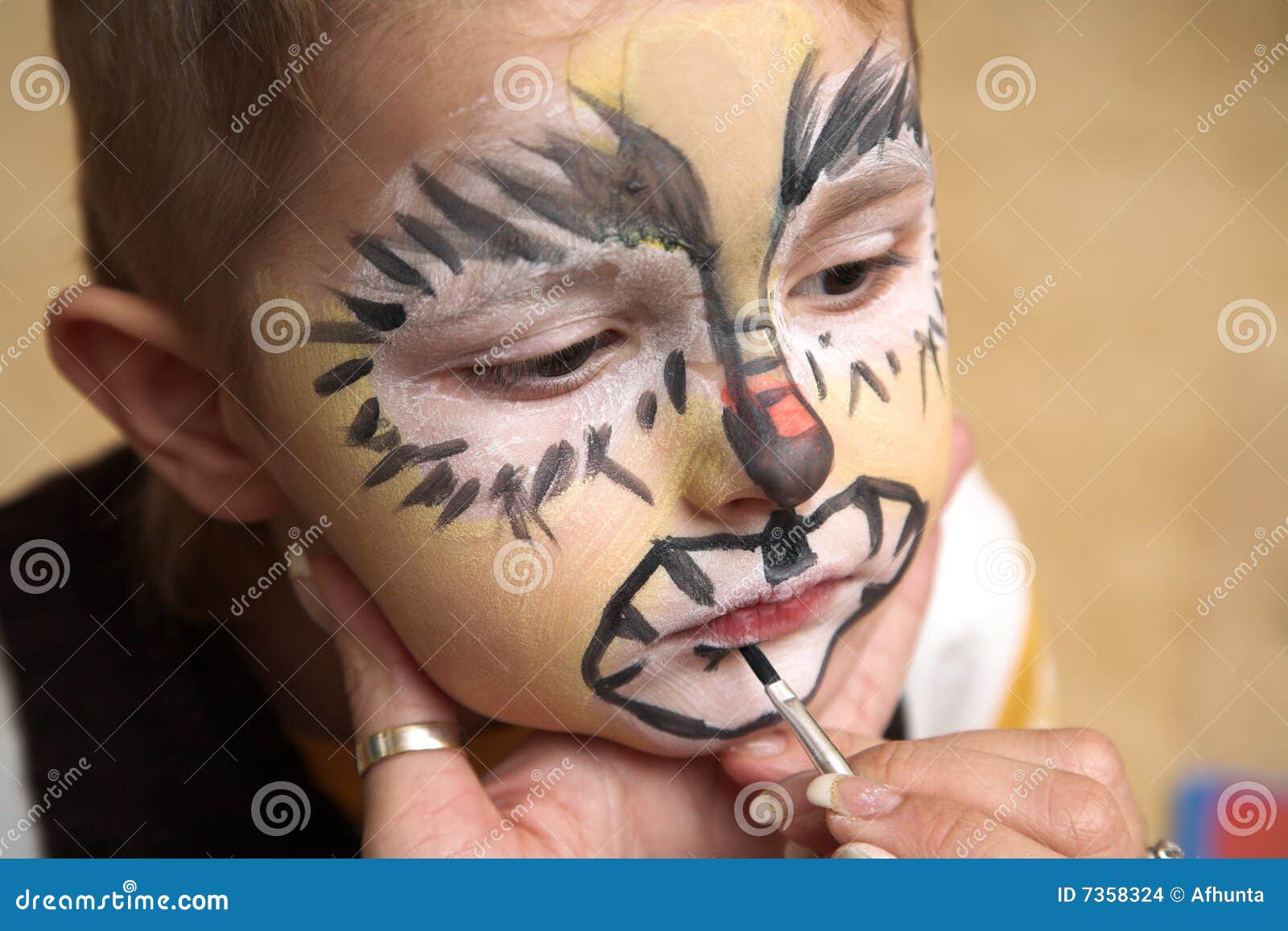 The boy and a make-up stock photo. Image of childhood - 7358324