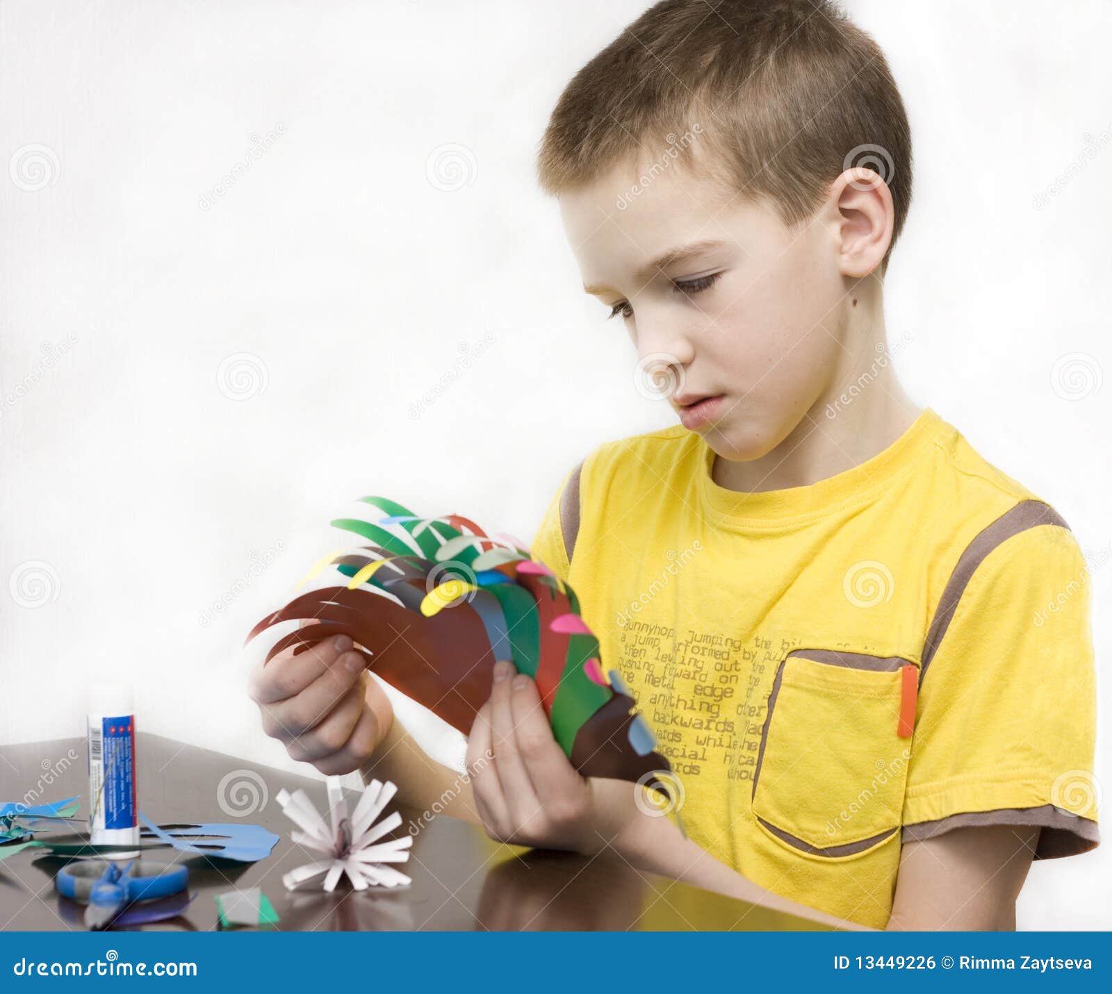 The boy makes crafts. stock photo. Image of teenager - 13449226