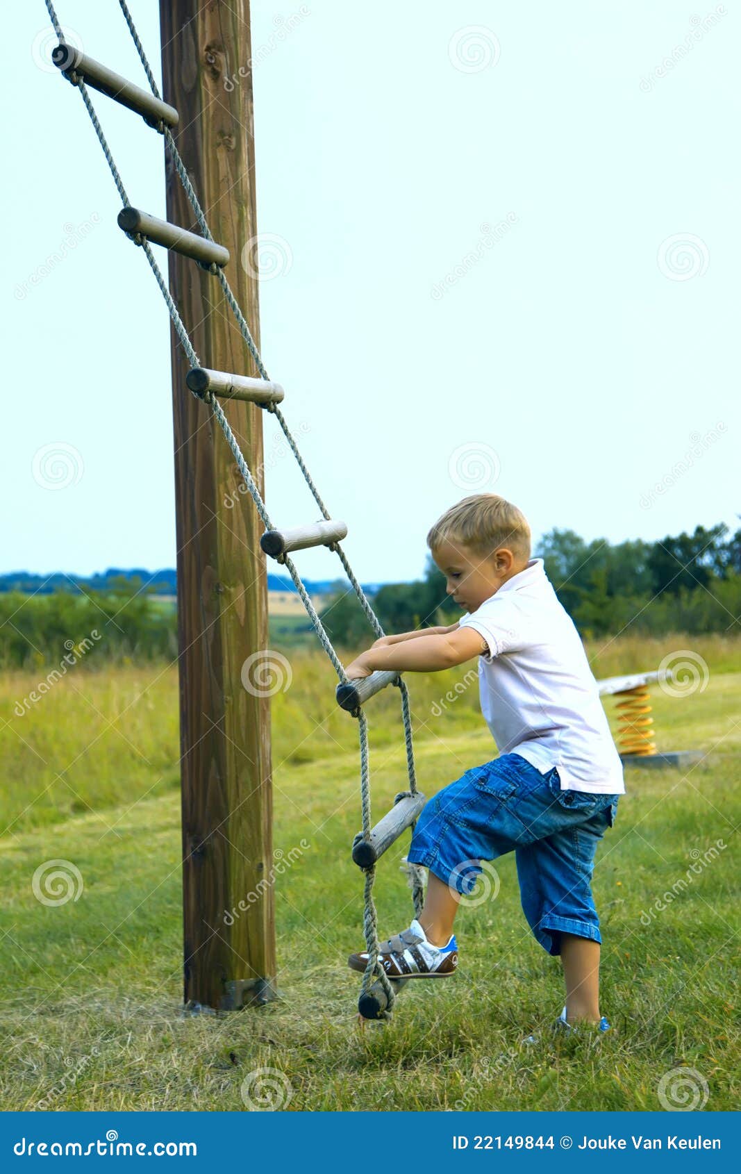 Boy is making a climb stock photo. Image of field, outside - 22149844