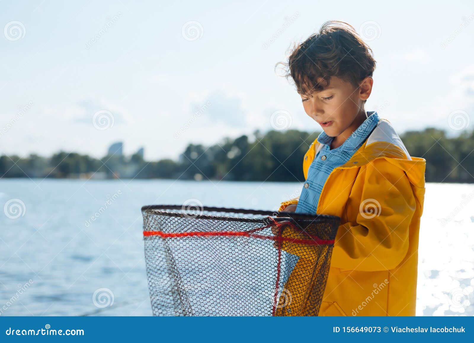 Boy Making Funny Face while Looking into Fishing Net Stock Image ...