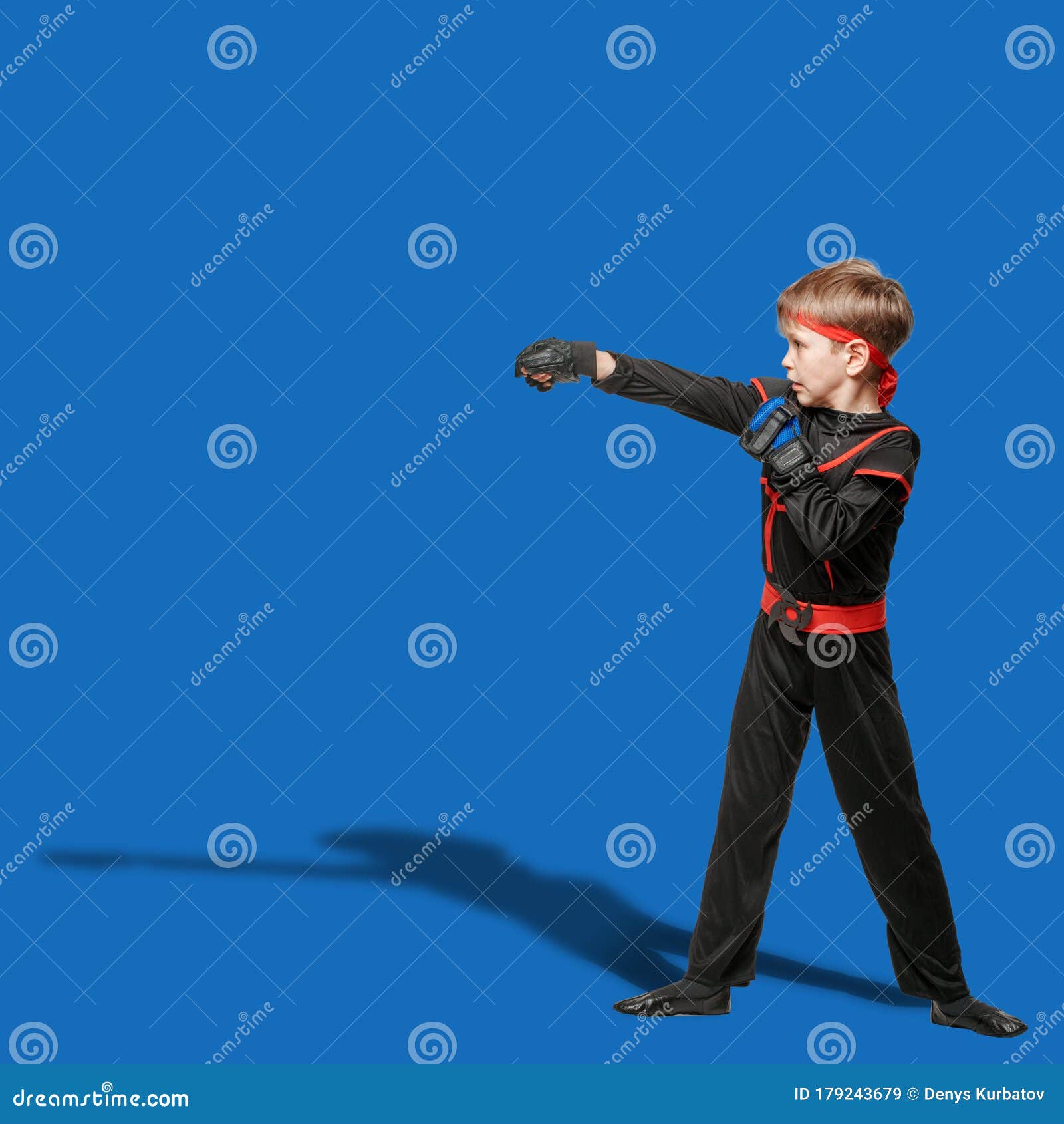 Boy making hit stock image. Image of karate, costume - 179243679