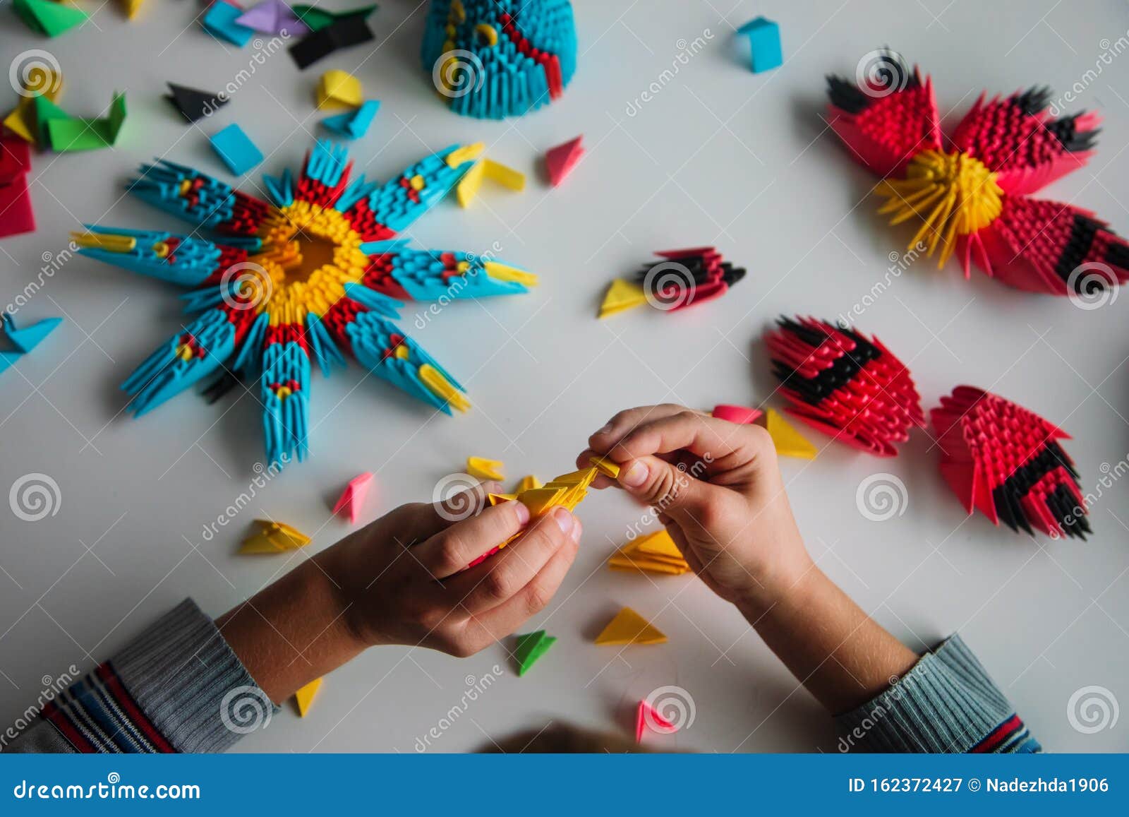 Boy Making Origami Crafts with Paper, Learning through Play Stock Image ...