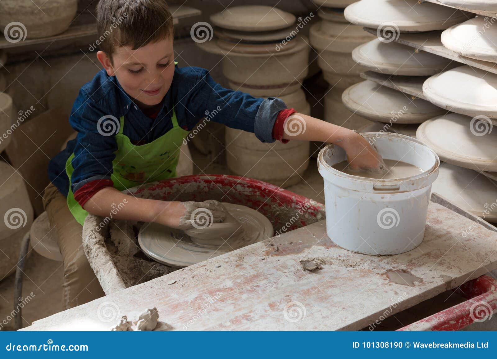 Boy making a pot stock photo. Image of clay, craft, craftsperson ...
