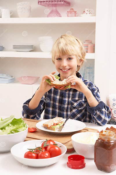 Boy Making Sandwich in Kitchen Stock Photo - Image of indoors ...