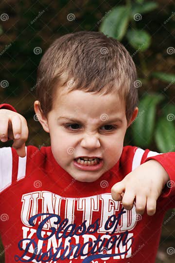 Boy making scary face stock photo. Image of grimaces, body - 9021014