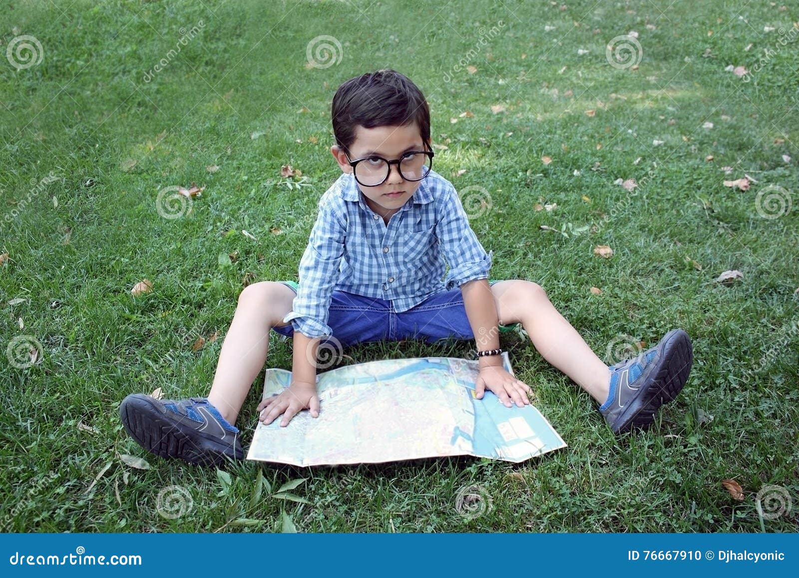 Boy with map stock photo. Image of outdoor, geek, reading - 76667910