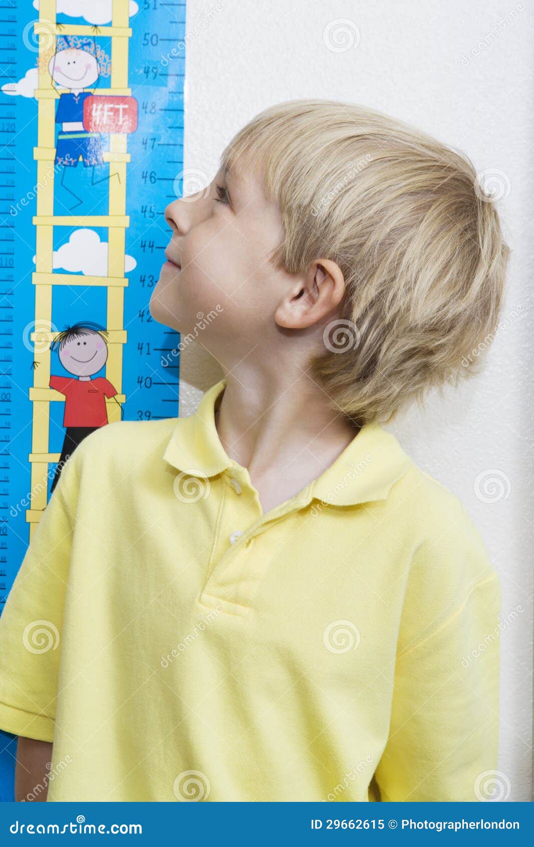 Boy Measuring Height in Classroom Stock Image - Image of educational ...