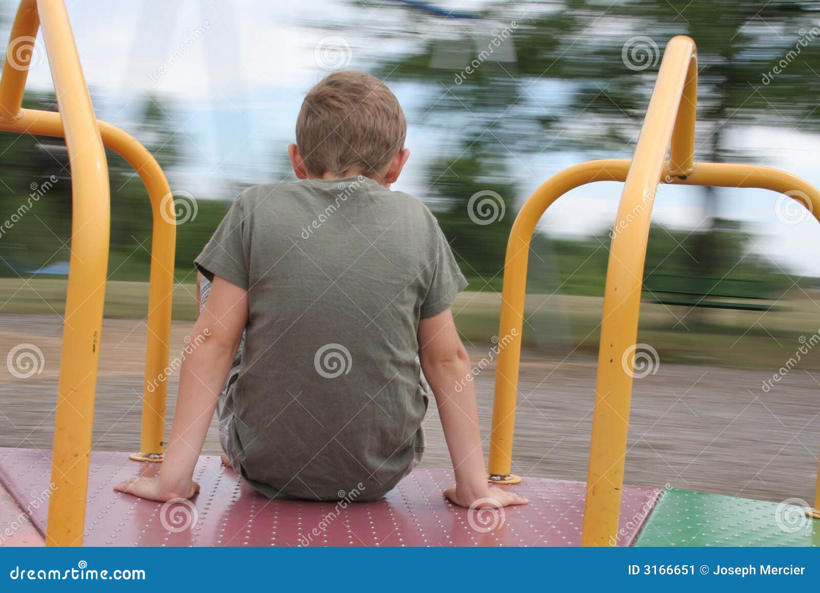 Boy on Merry Go Round stock image. Image of park, kids - 3166651