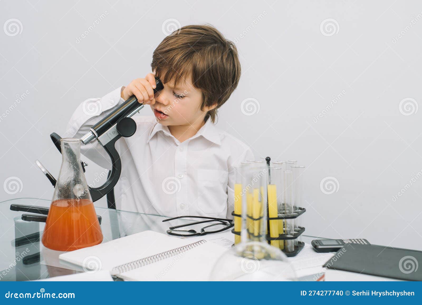 The Boy With A Microscope And Various Colorful Flasks On A White ...