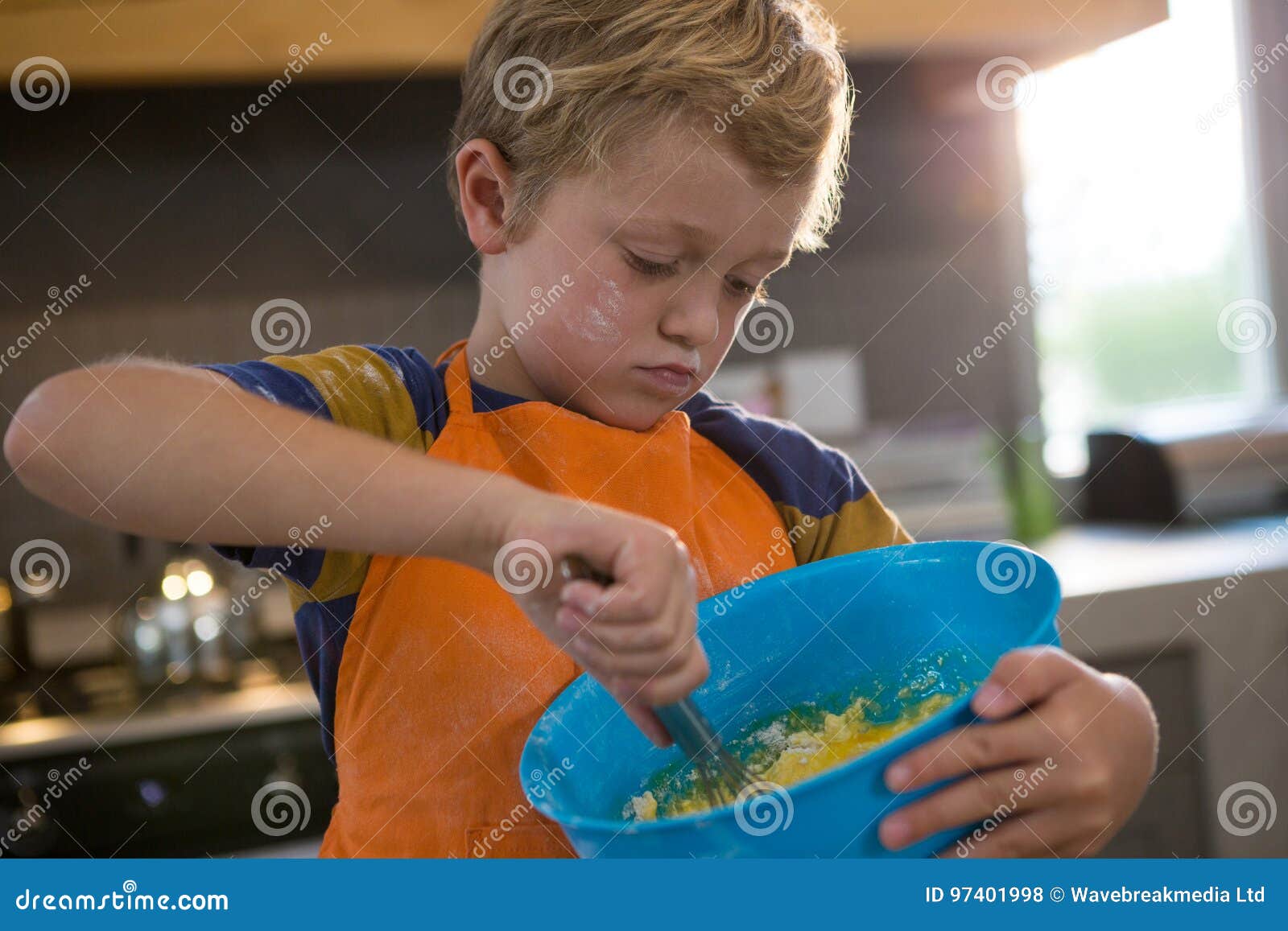 Boy Mixing Batter in Blue Container Stock Photo - Image of container ...