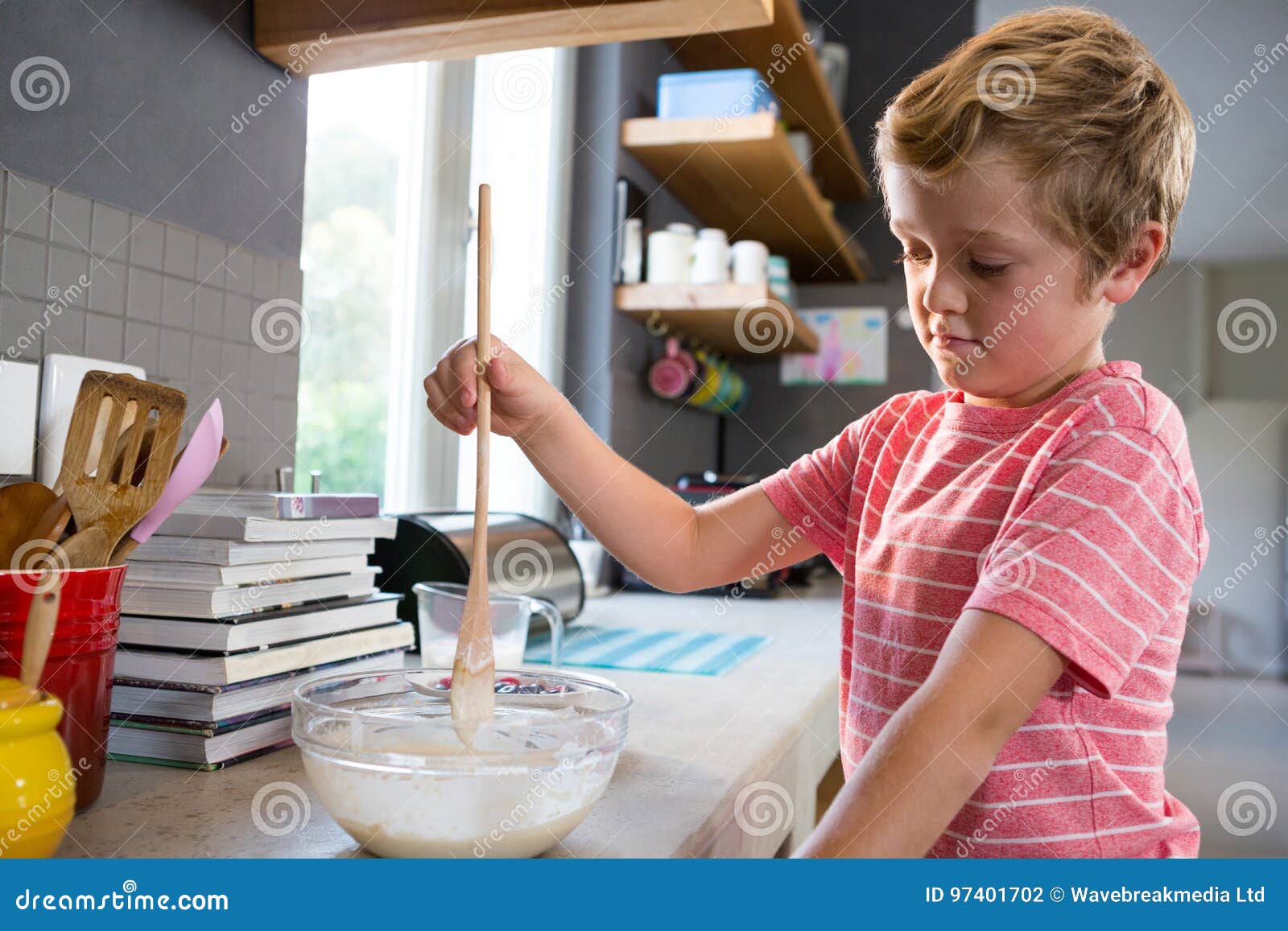 Boy Mixing Batter at Counter Stock Photo - Image of cute, house: 97401702