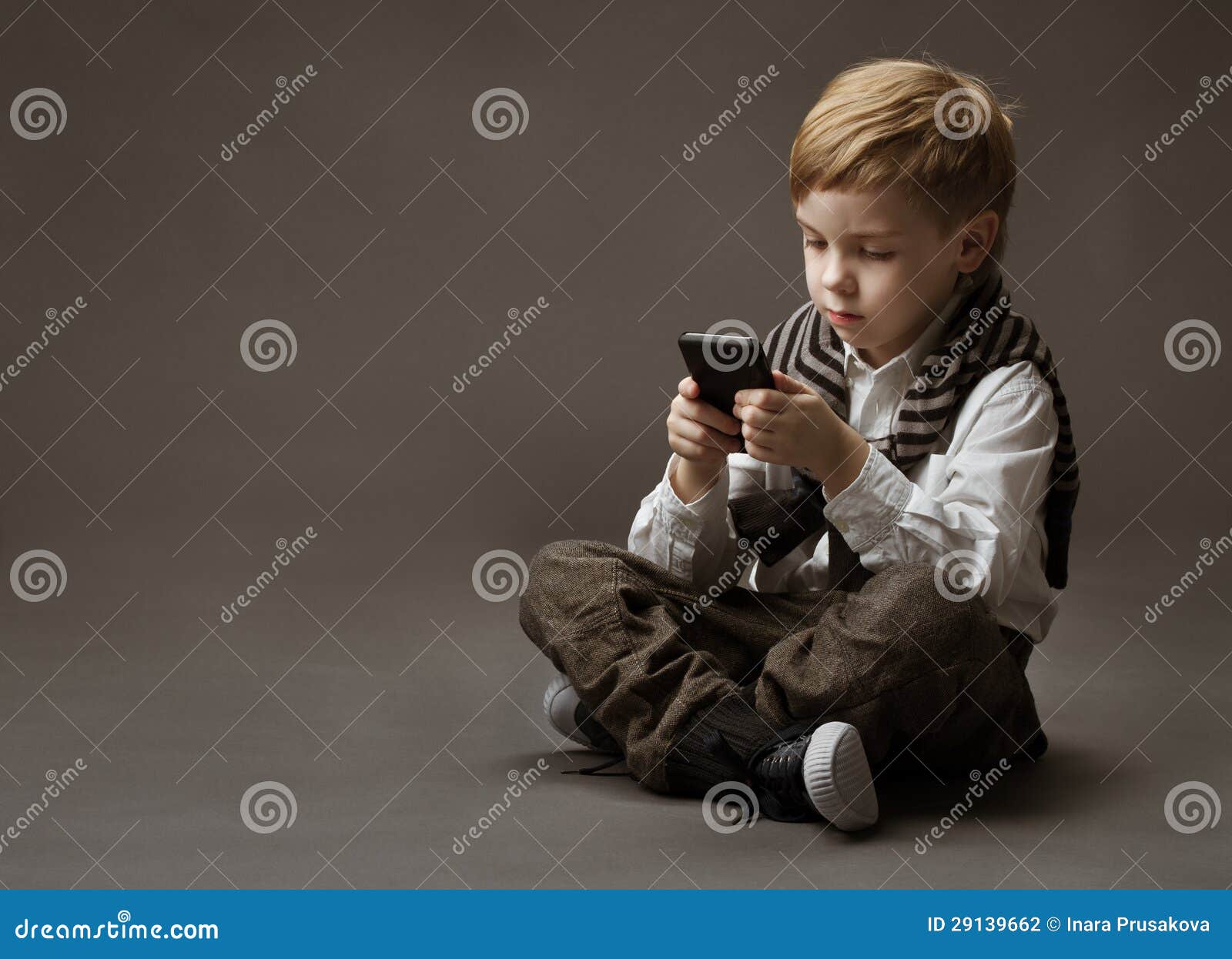 Boy with mobile phone stock photo. Image of grey, cell - 29139662