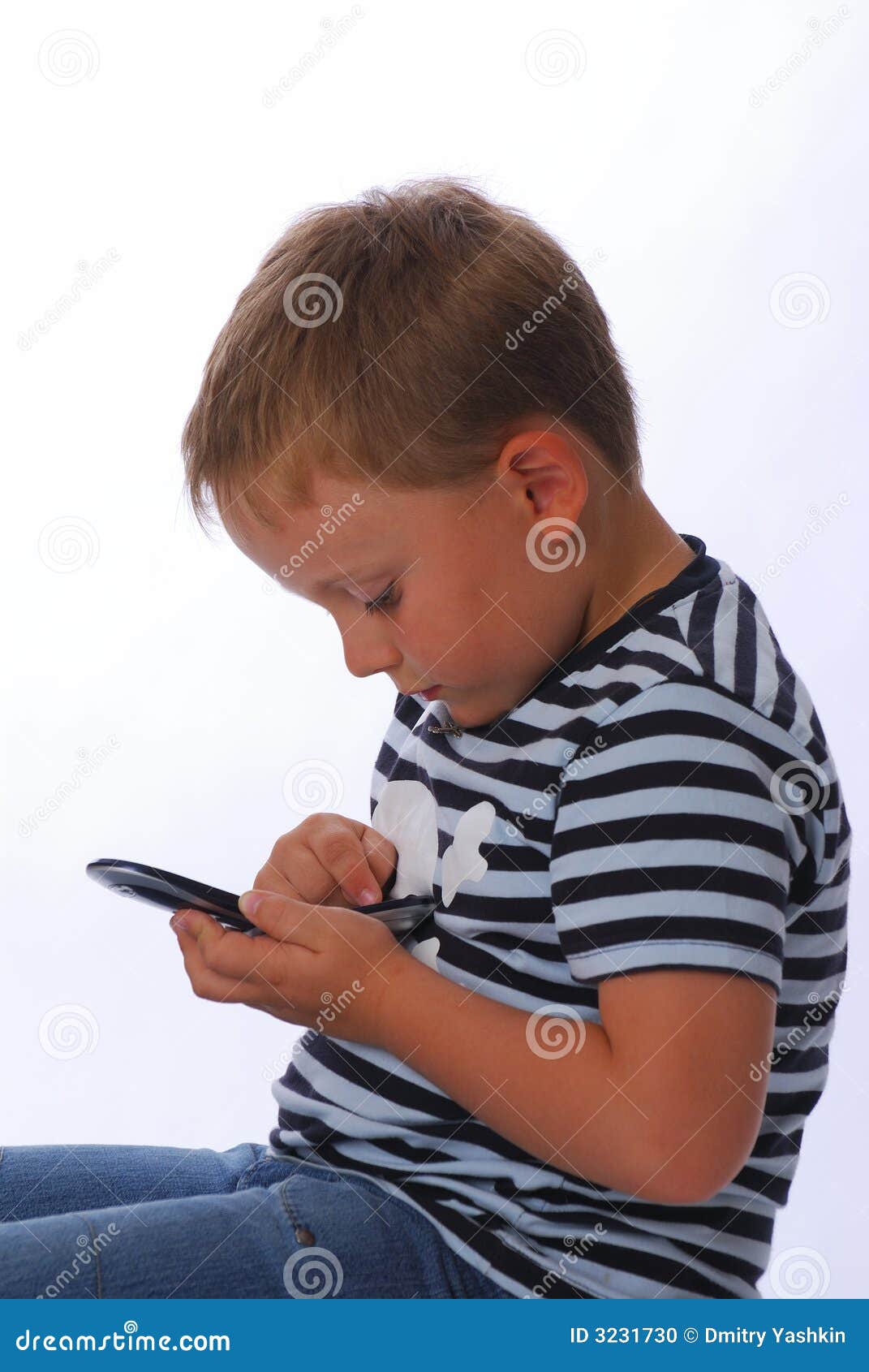 A Boy With Mobile Phone Picture. Image: 3231730