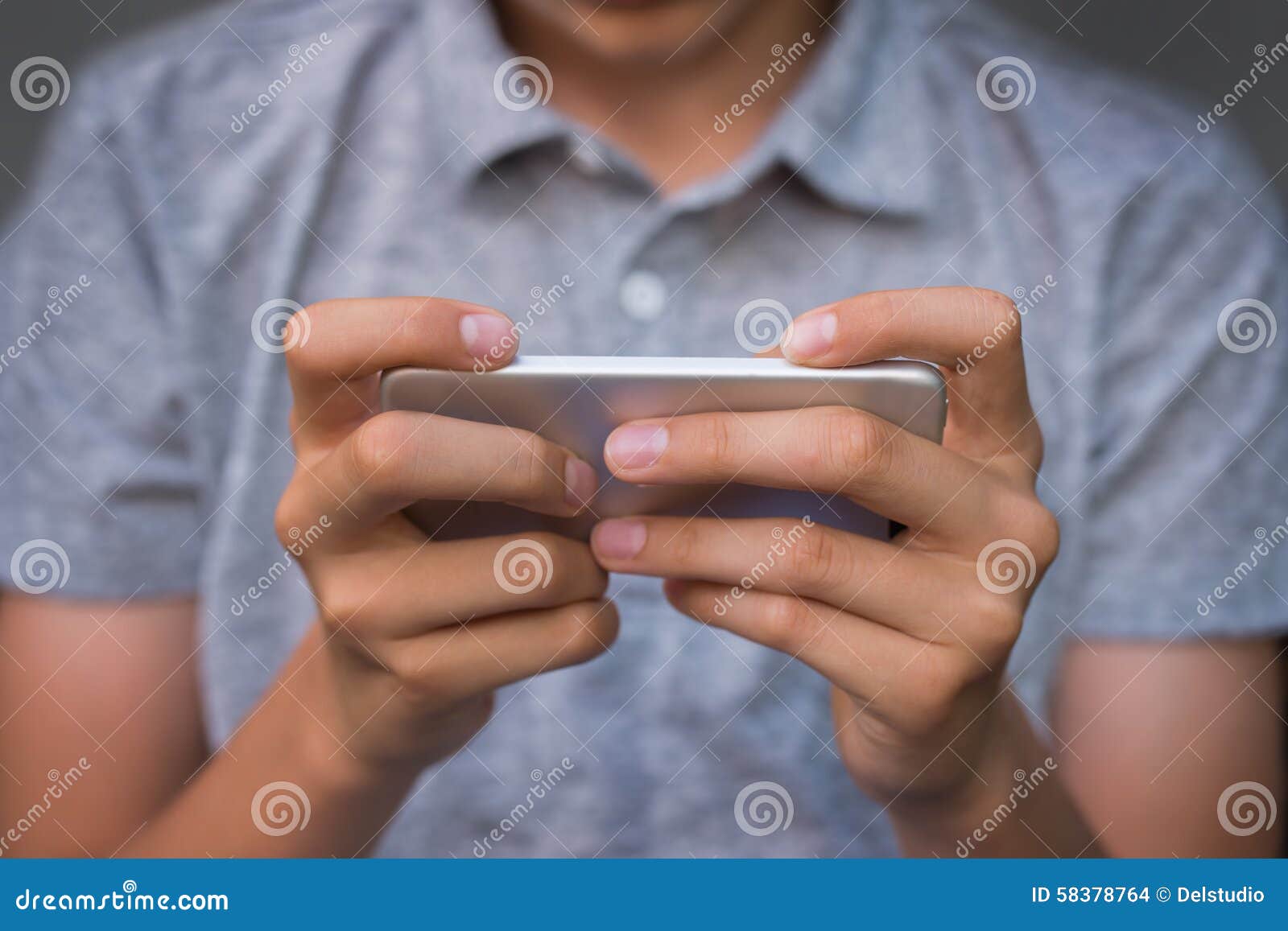 Boy with a mobile phone stock photo. Image of people - 58378764