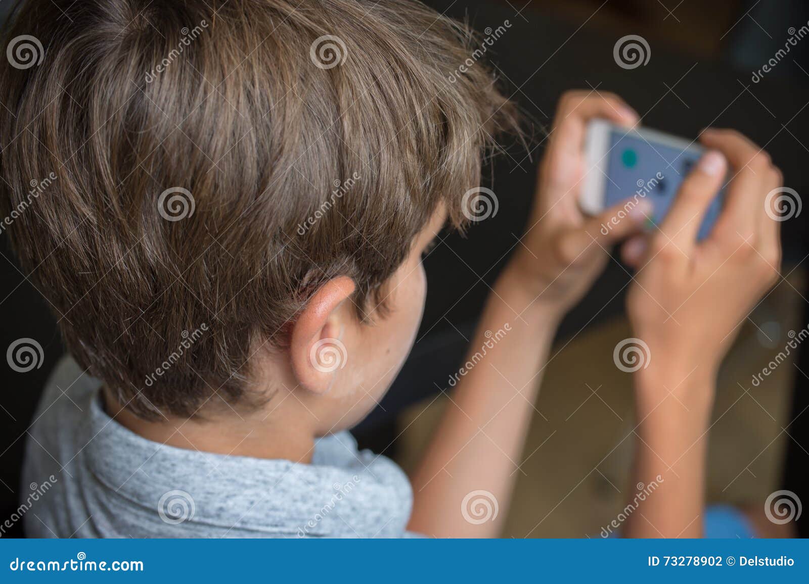 Boy with a mobile phone stock photo. Image of smartphone - 73278902