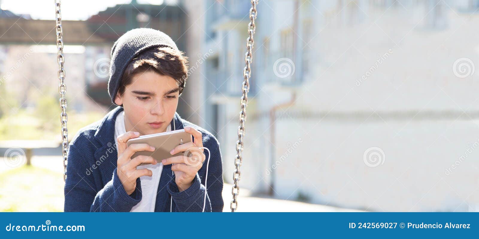 Boy with mobile phone stock image. Image of smiling - 242569027