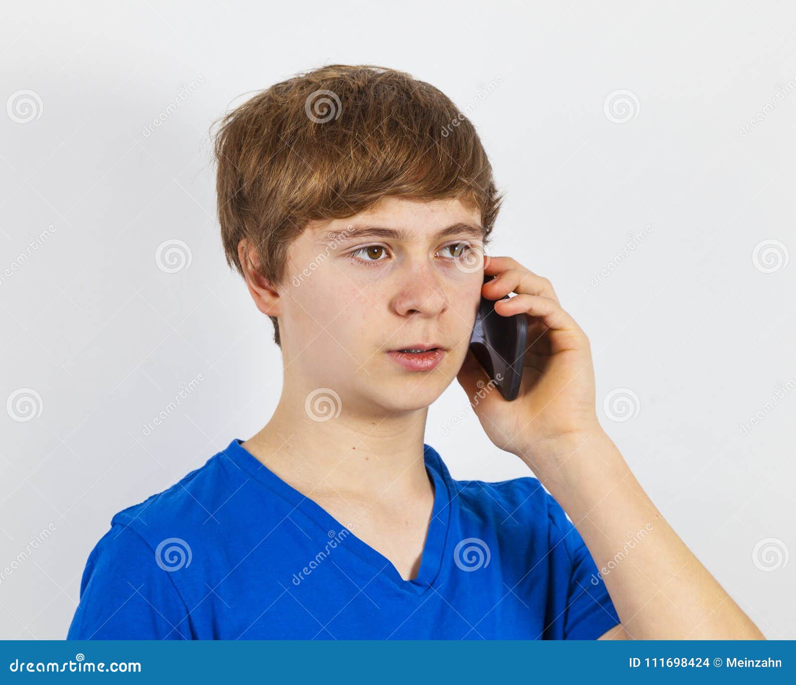 Boy with a mobile phone stock photo. Image of modern - 111698424