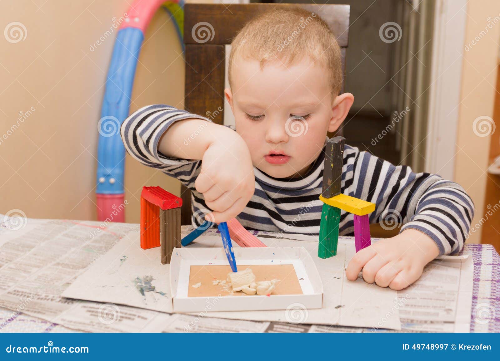 The boy molds plasticine stock image. Image of babies - 49748997
