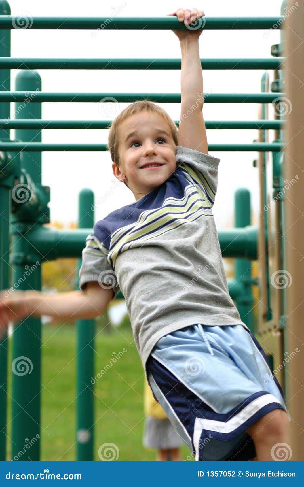 Boy on Monkey Bars stock photo. Image of monkey, hang - 1357052