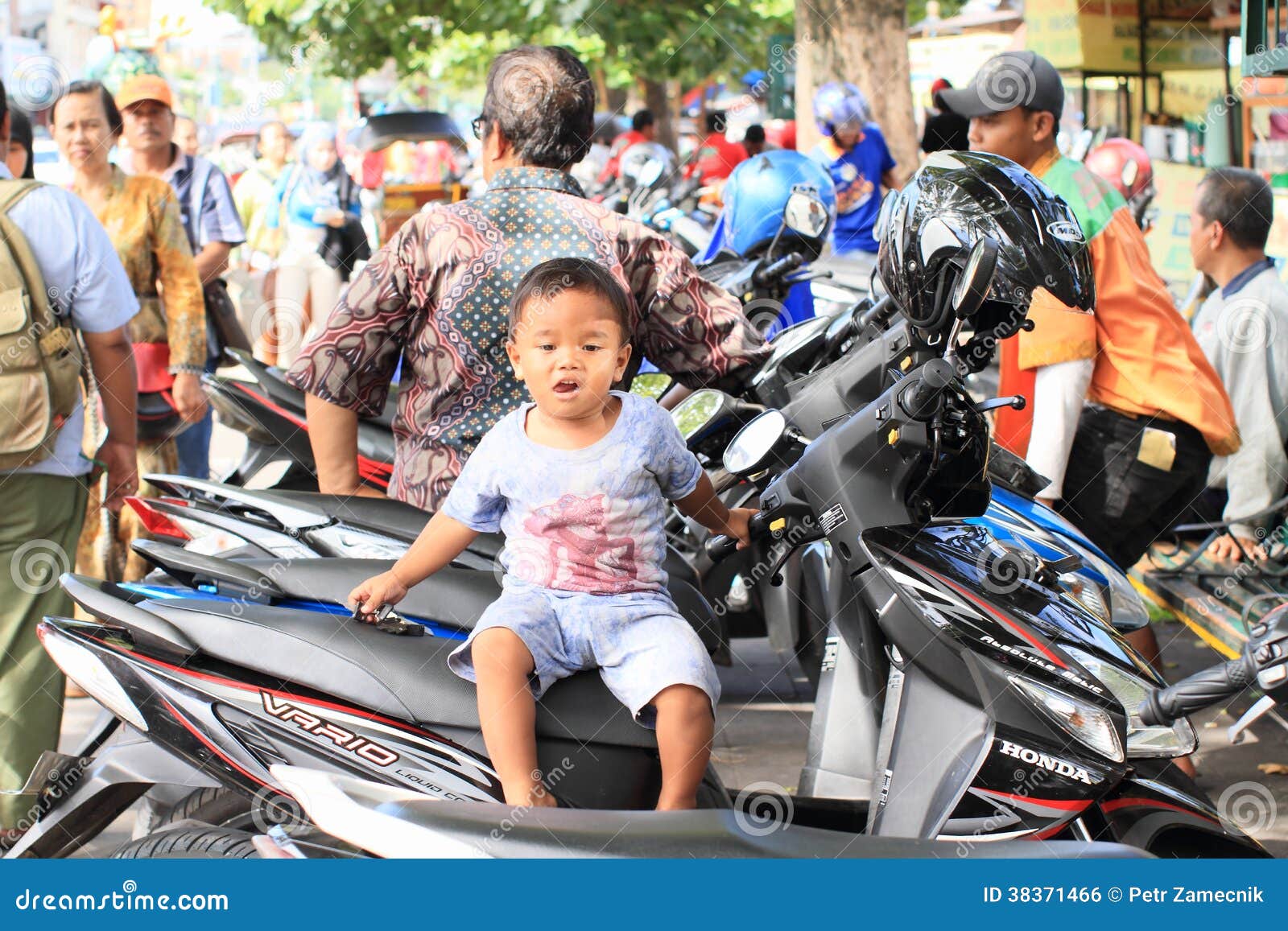 Boy on motorbike editorial photo. Image of yogyakarta - 38371466