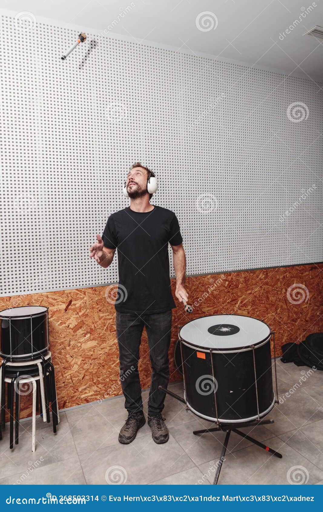 Boy Next To a Drum Throwing a Mace into the Air Stock Photo - Image of ...