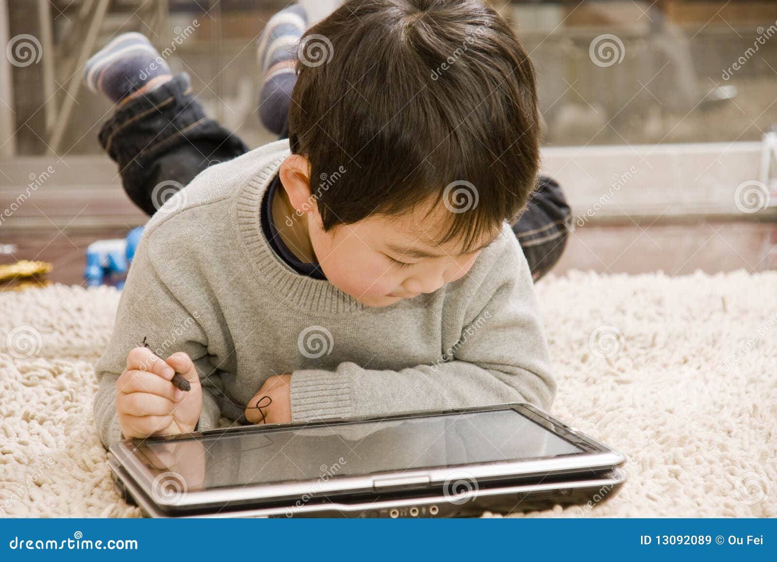 Boy and notebook stock image. Image of notebook, tablet - 13092089