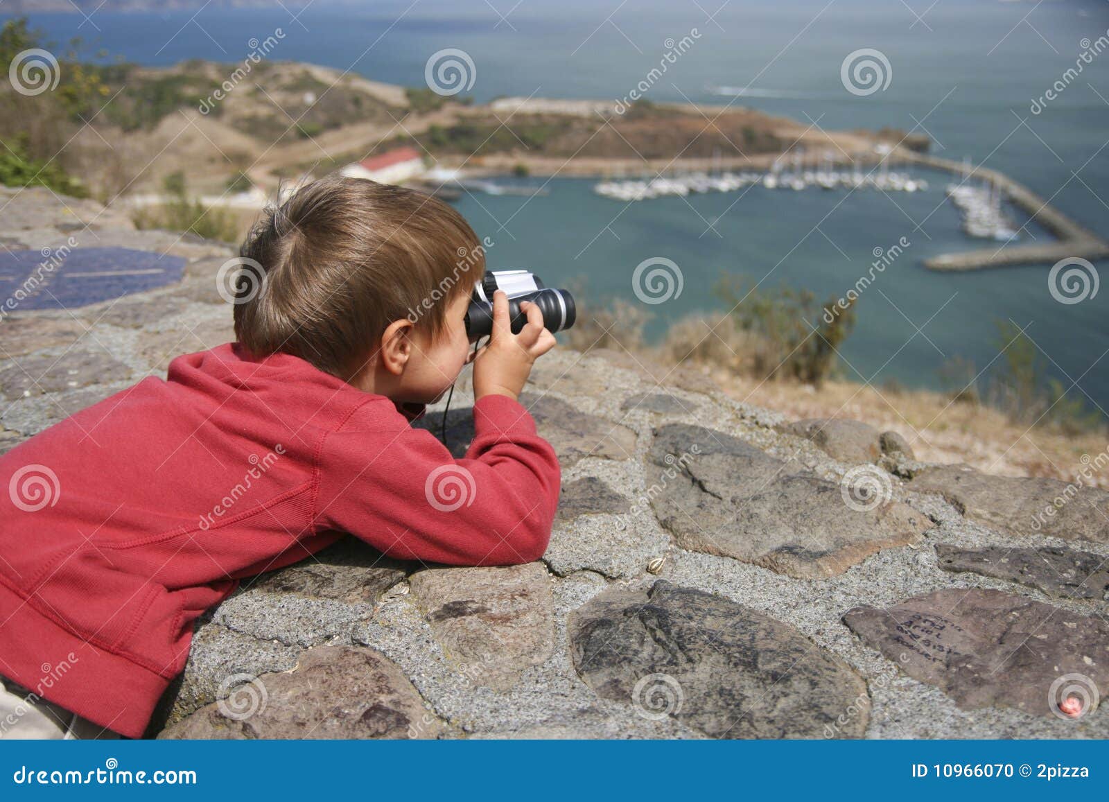 Boy Observes View through Binoculars Stock Photo - Image of pier ...