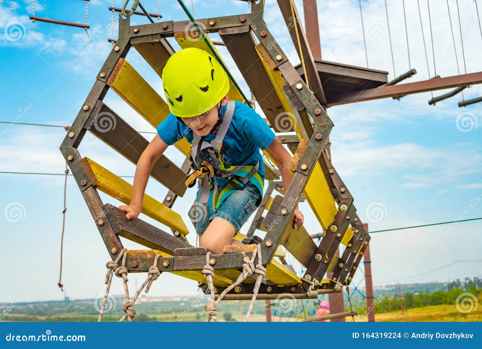A Boy on an Obstacle Course Overcomes Difficulties with Moving in a ...