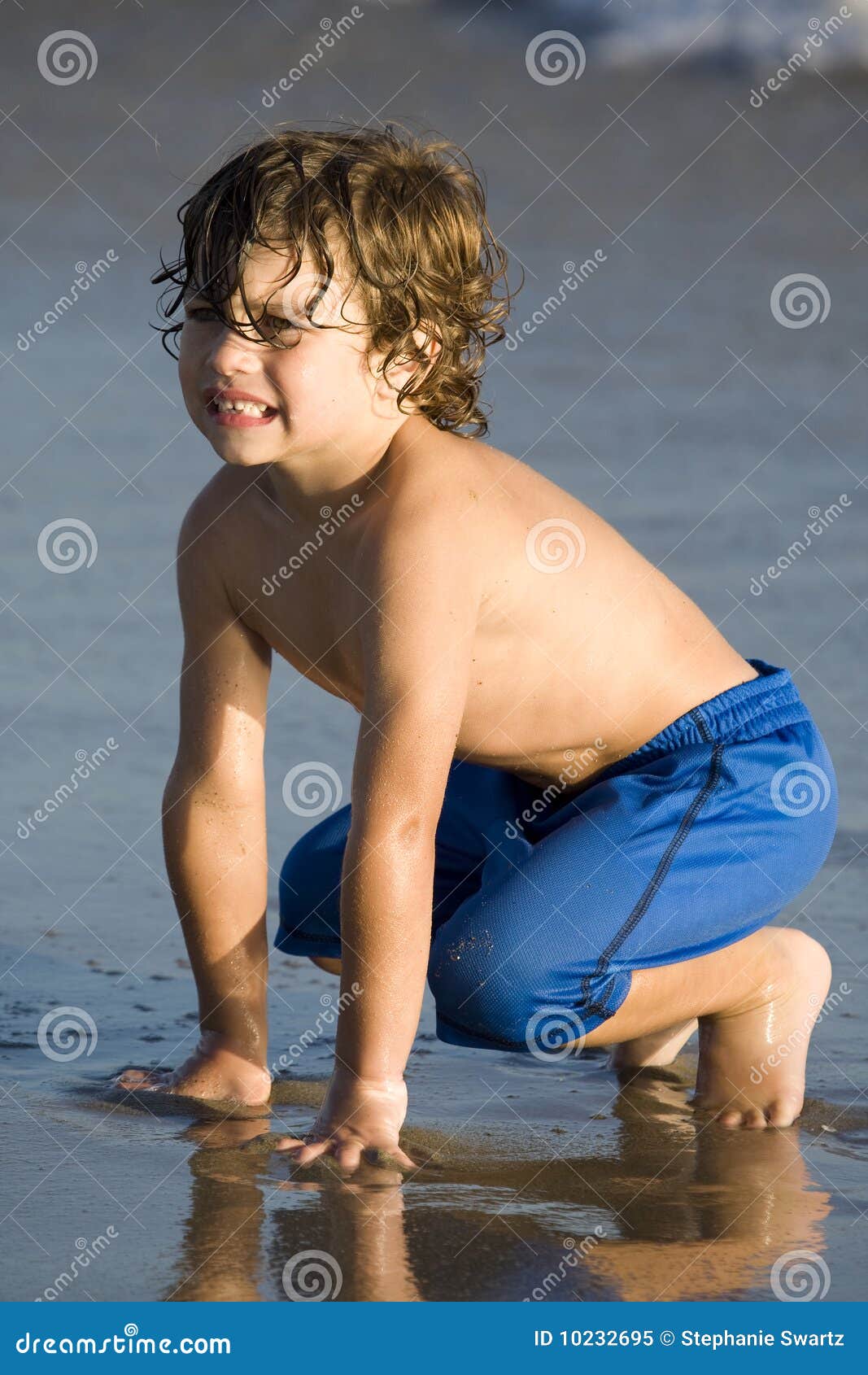 Boy in the ocean stock image. Image of sand, people, holiday - 10232695