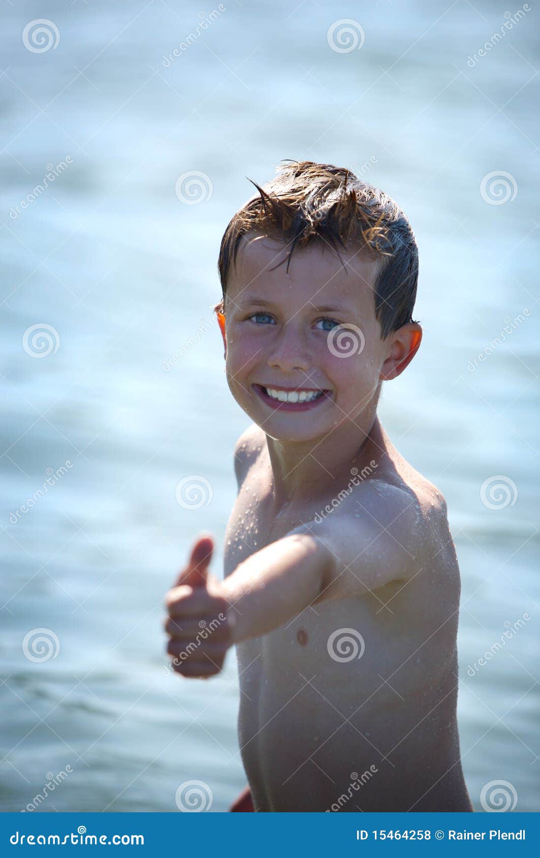 Boy in ocean stock photo. Image of sunny, beach, standing - 15464258