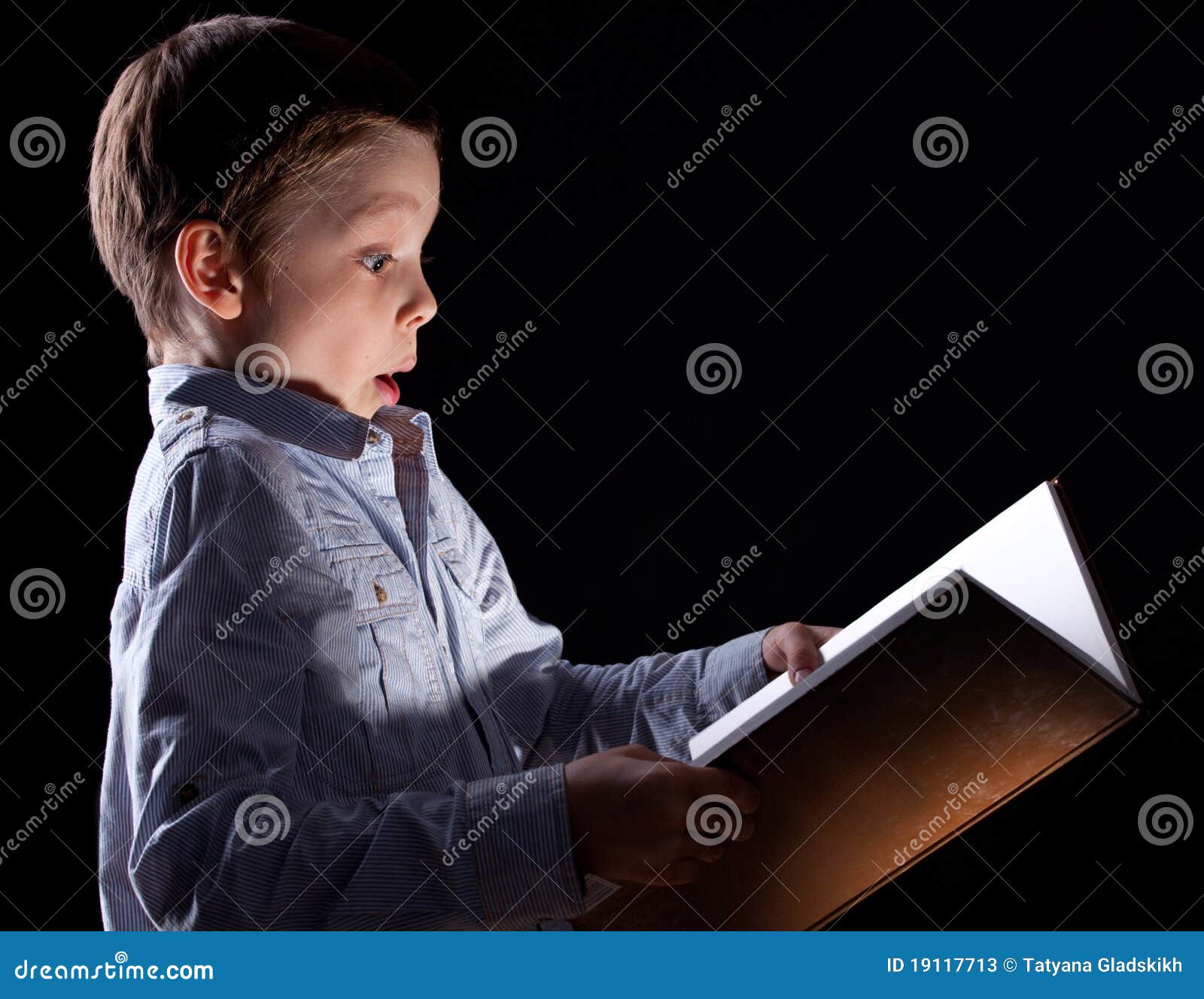 Boy opened a magic book stock image. Image of male, discovery - 19117713