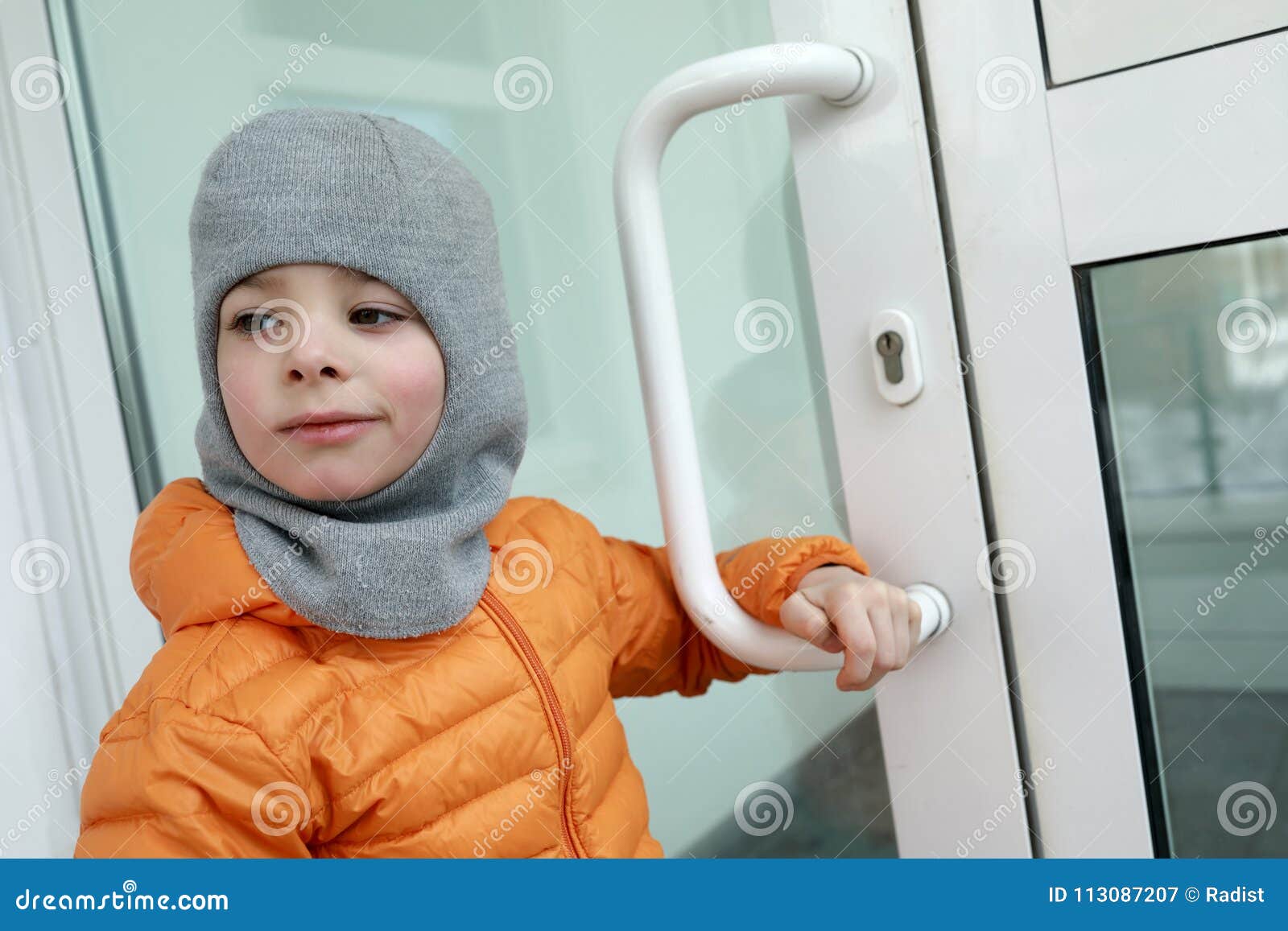 Boy opens door stock image. Image of door, look, childhood - 113087207