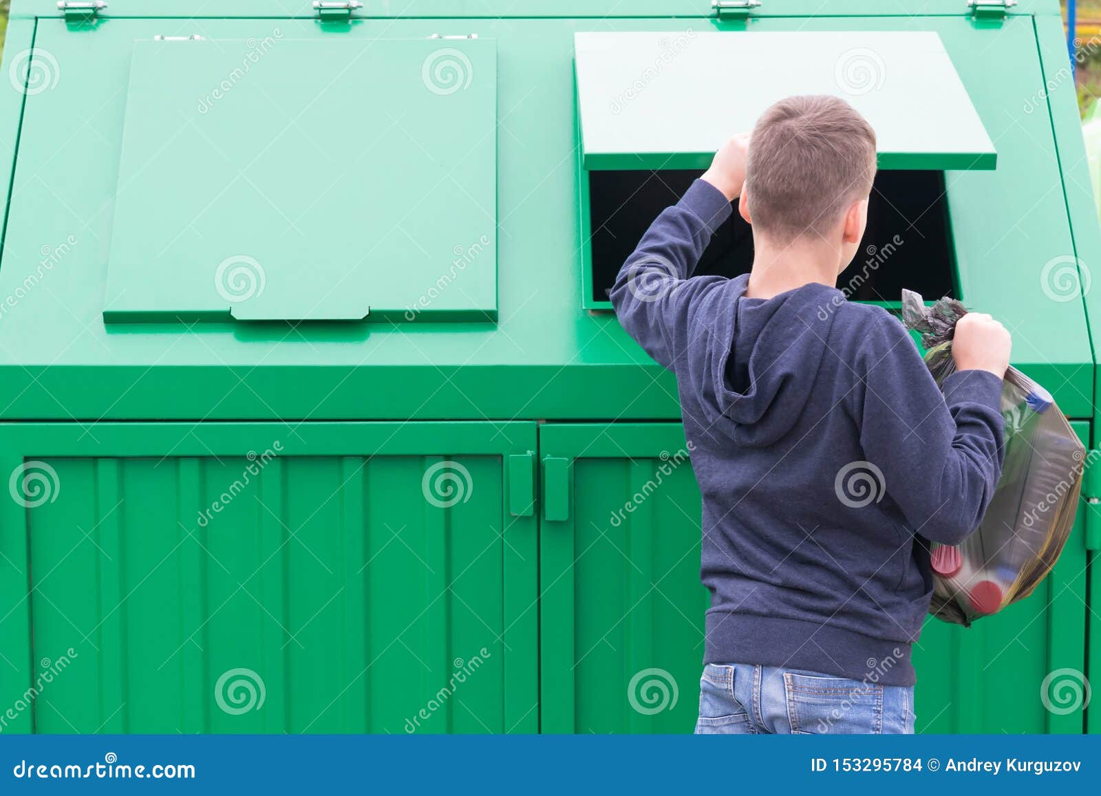The Boy Opens the Waste Tank To Throw Out a Big Black Bag of Garbage ...
