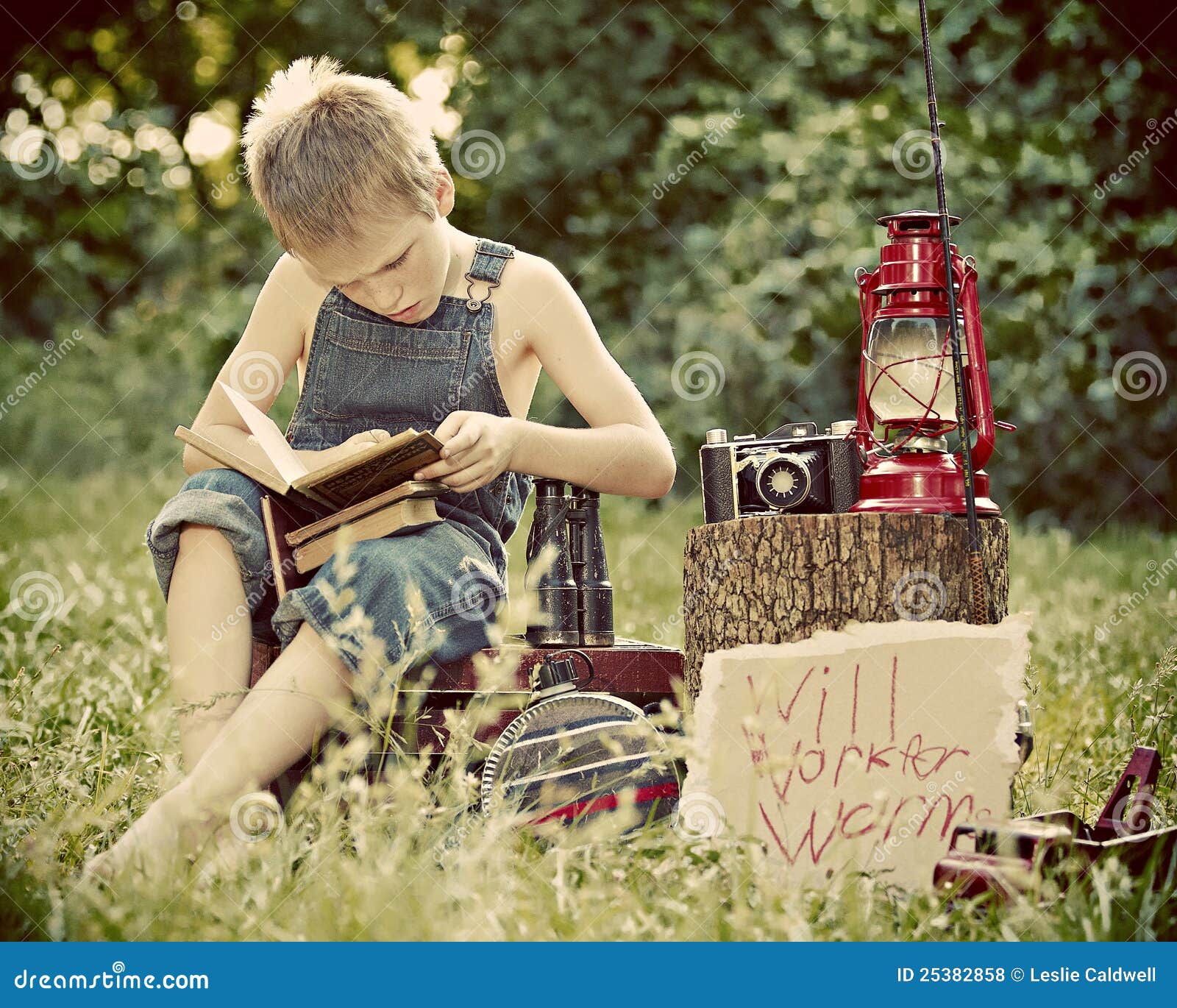 Boy outside reading stock photo. Image of intelligent - 25382858