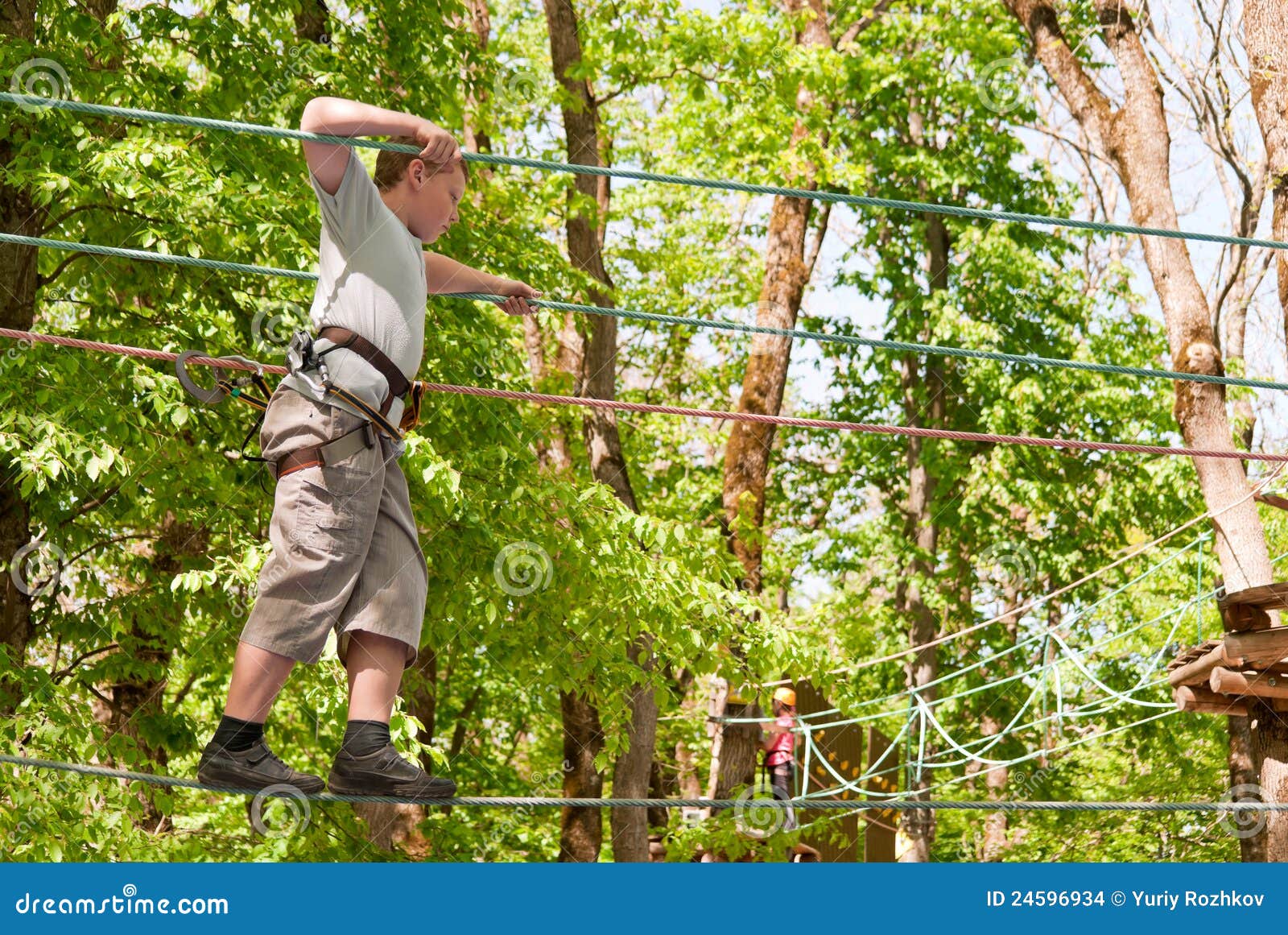 A Boy Overcomes Obstacles, Walking on a Rope Stock Photo - Image of ...