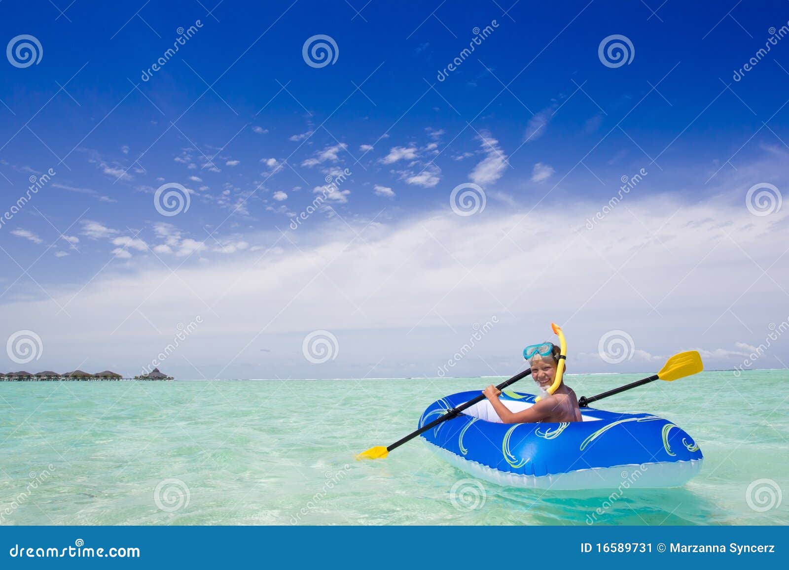 Boy paddling rubber raft stock image. Image of water - 16589731