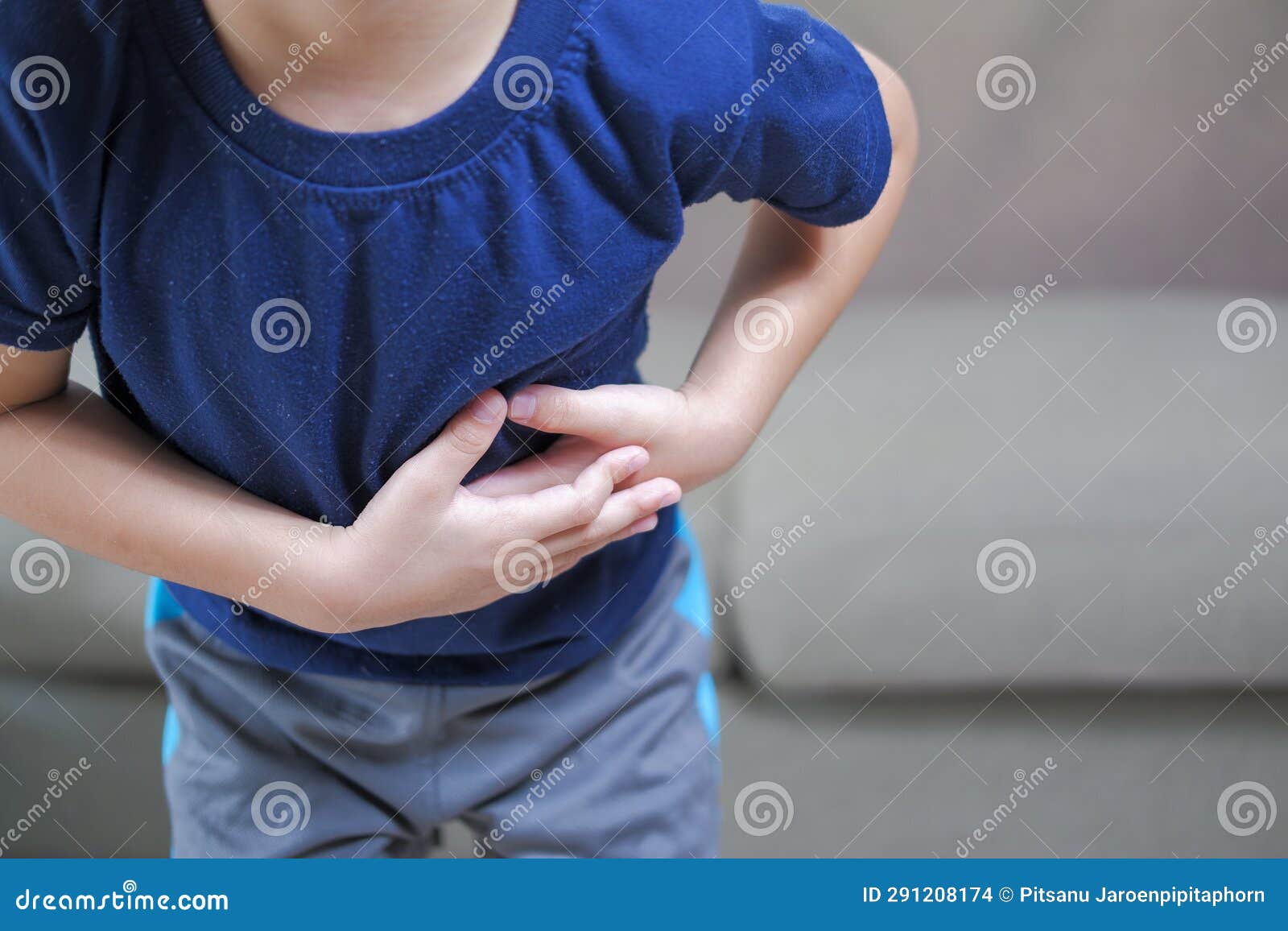 A Boy with Pain in His Stomach Rubs His Stomach on the Pain Point Stock ...