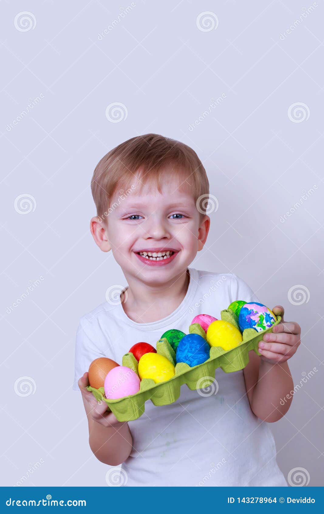Boy with painted eggs stock photo. Image of easter, blond - 143278964