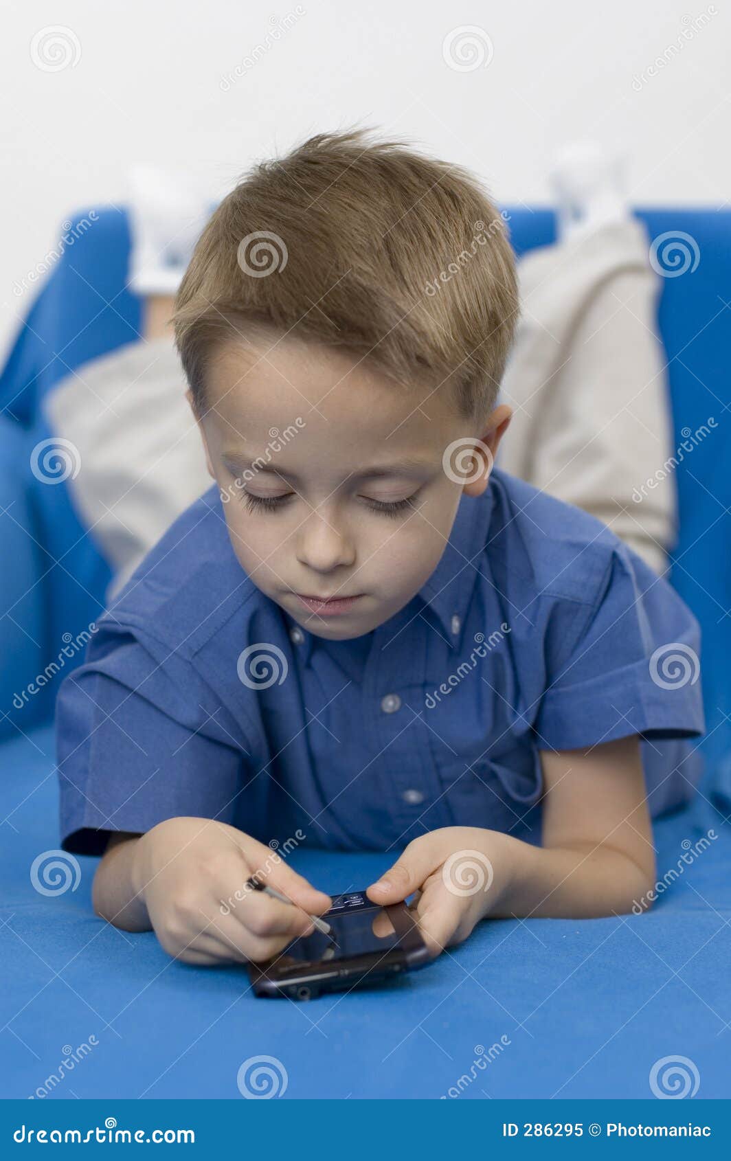 Boy / palmtop / white stock image. Image of optical, light - 286295