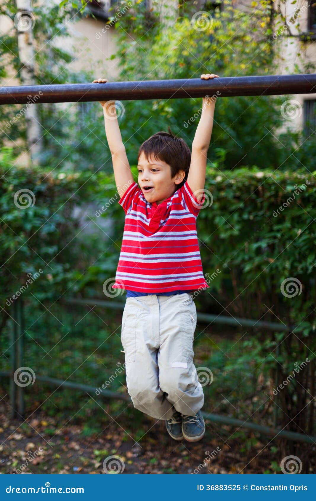 Boy in park hanging stock image. Image of smiling, acrobatic - 36883525