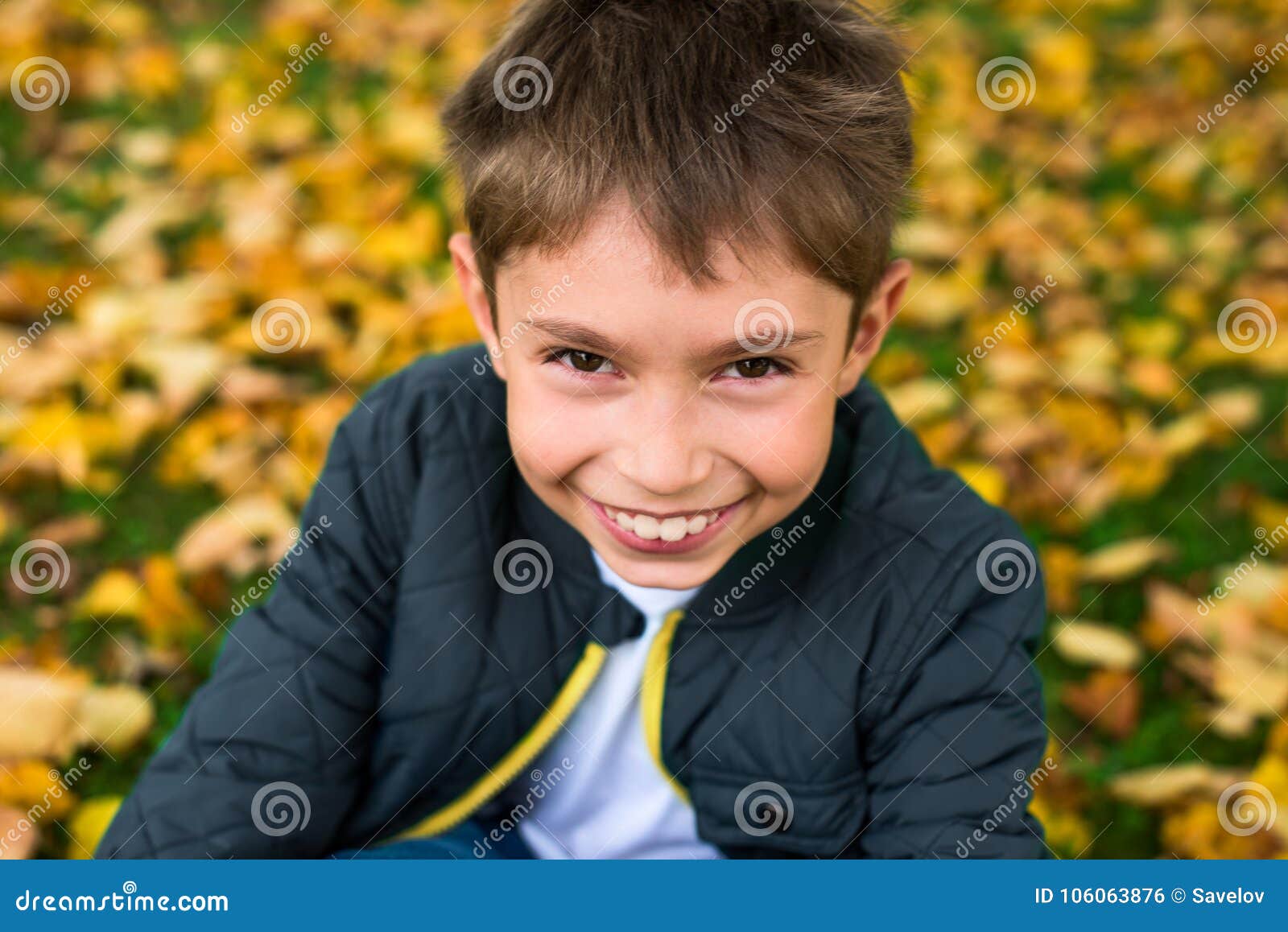 Boy in Park Smiling Looking from Bottom To Top Stock Photo - Image of ...
