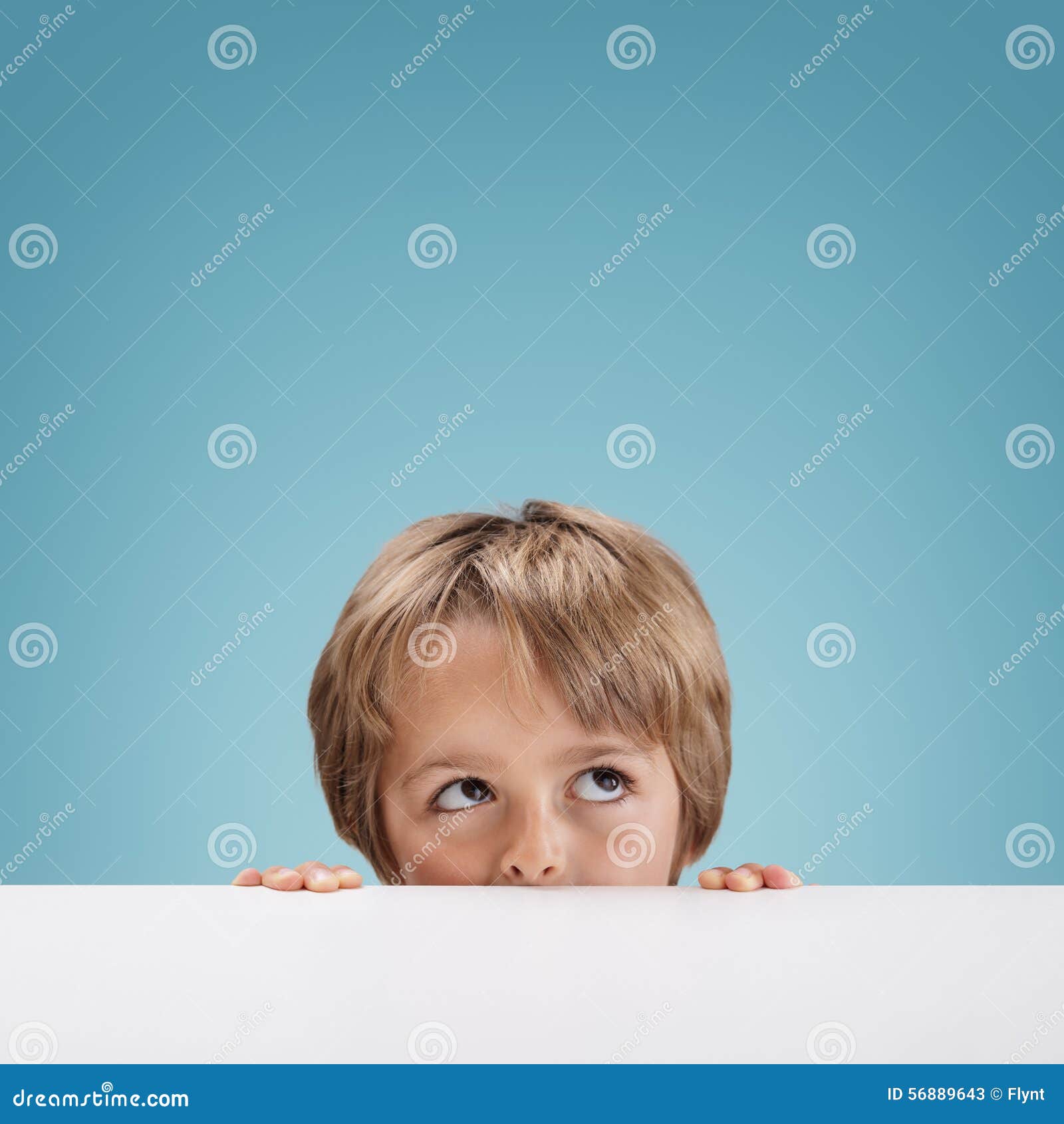 Boy Peeking Over a White Board Stock Image - Image of child, head: 56889643